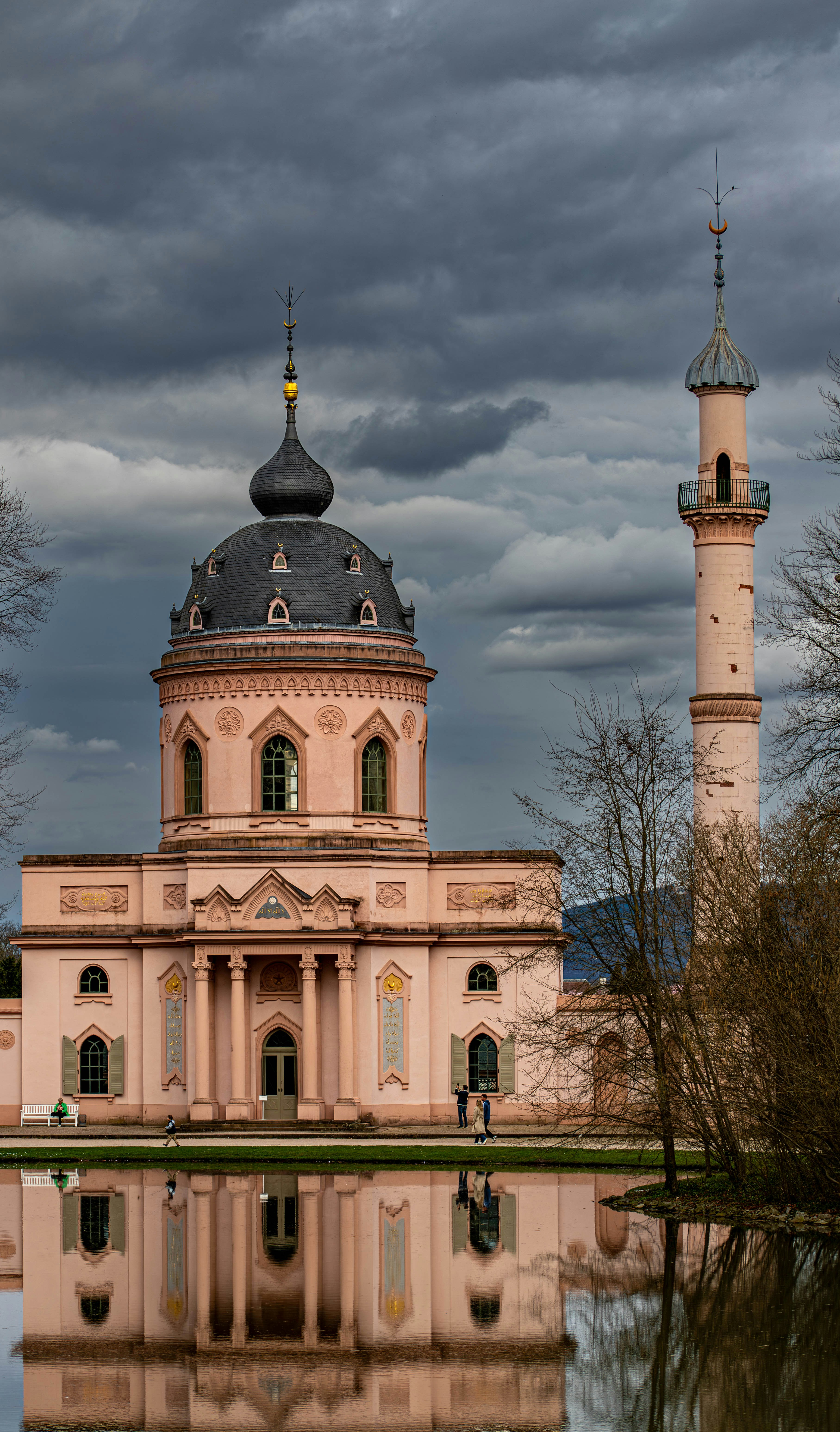 Beautiful pink building reflects in calm water. photo – Free Building ...