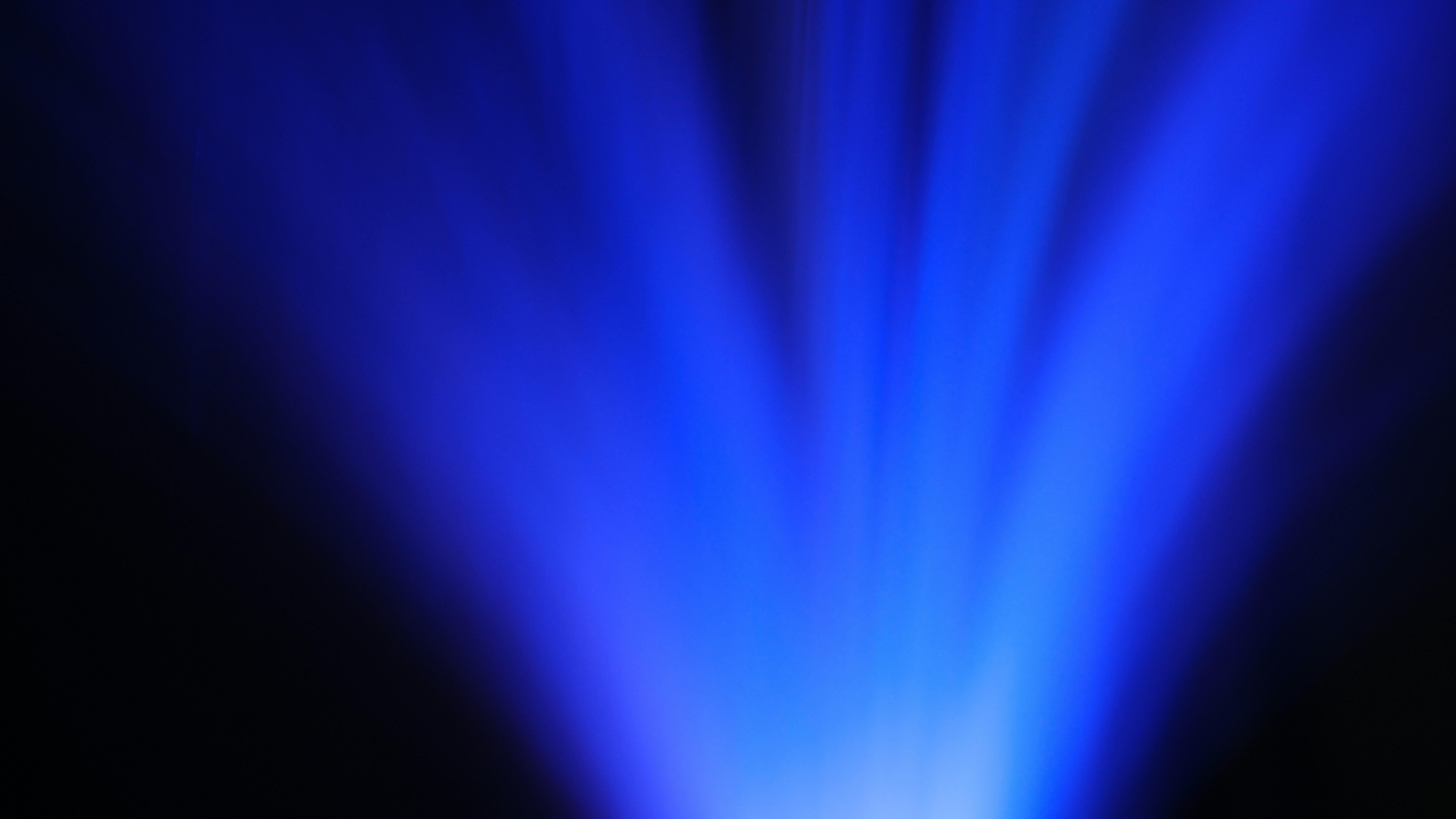 Blue light beams illuminating against a dark background. photo – Free ...
