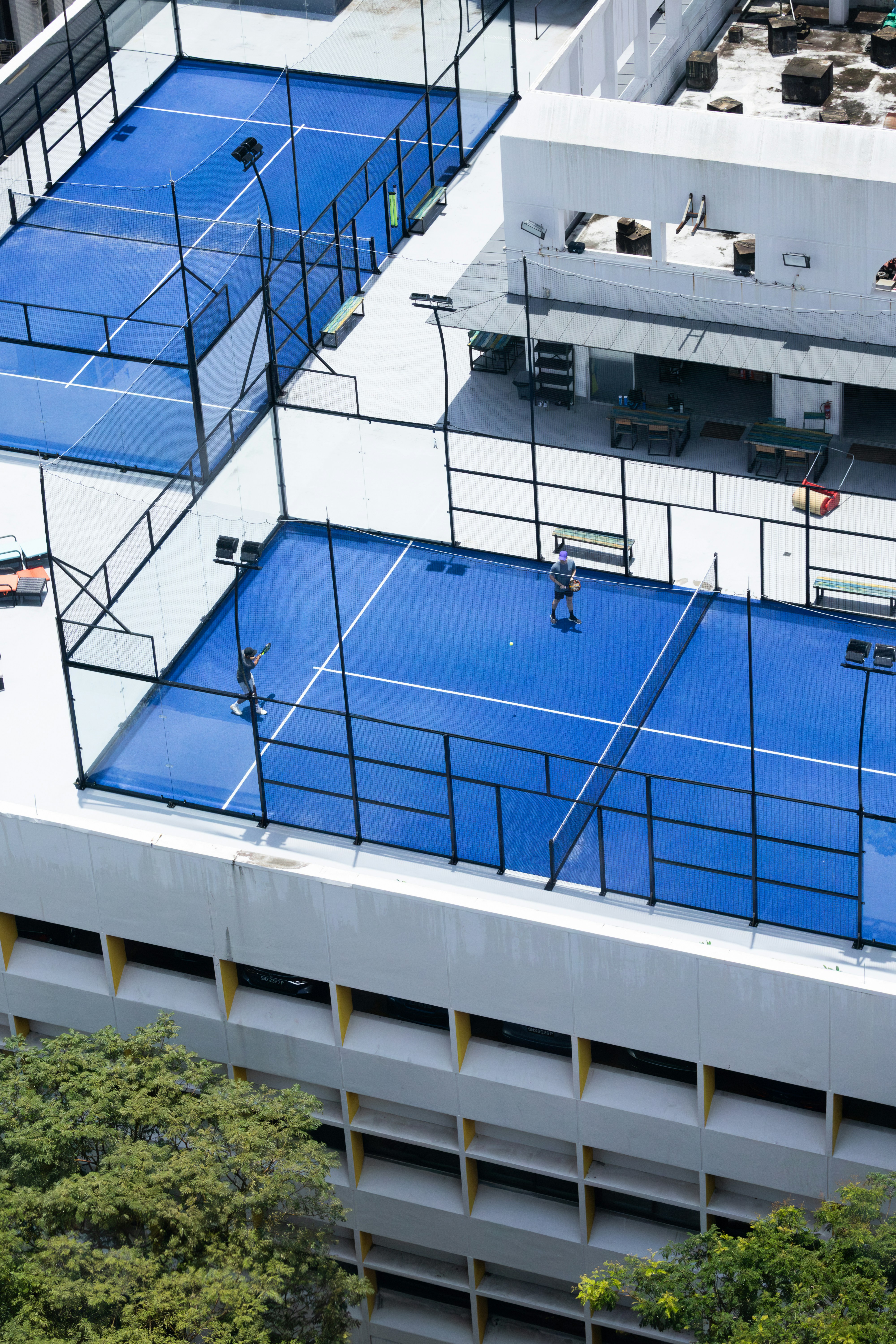 Two padel courts on a building rooftop. photo – Free Building Image on ...