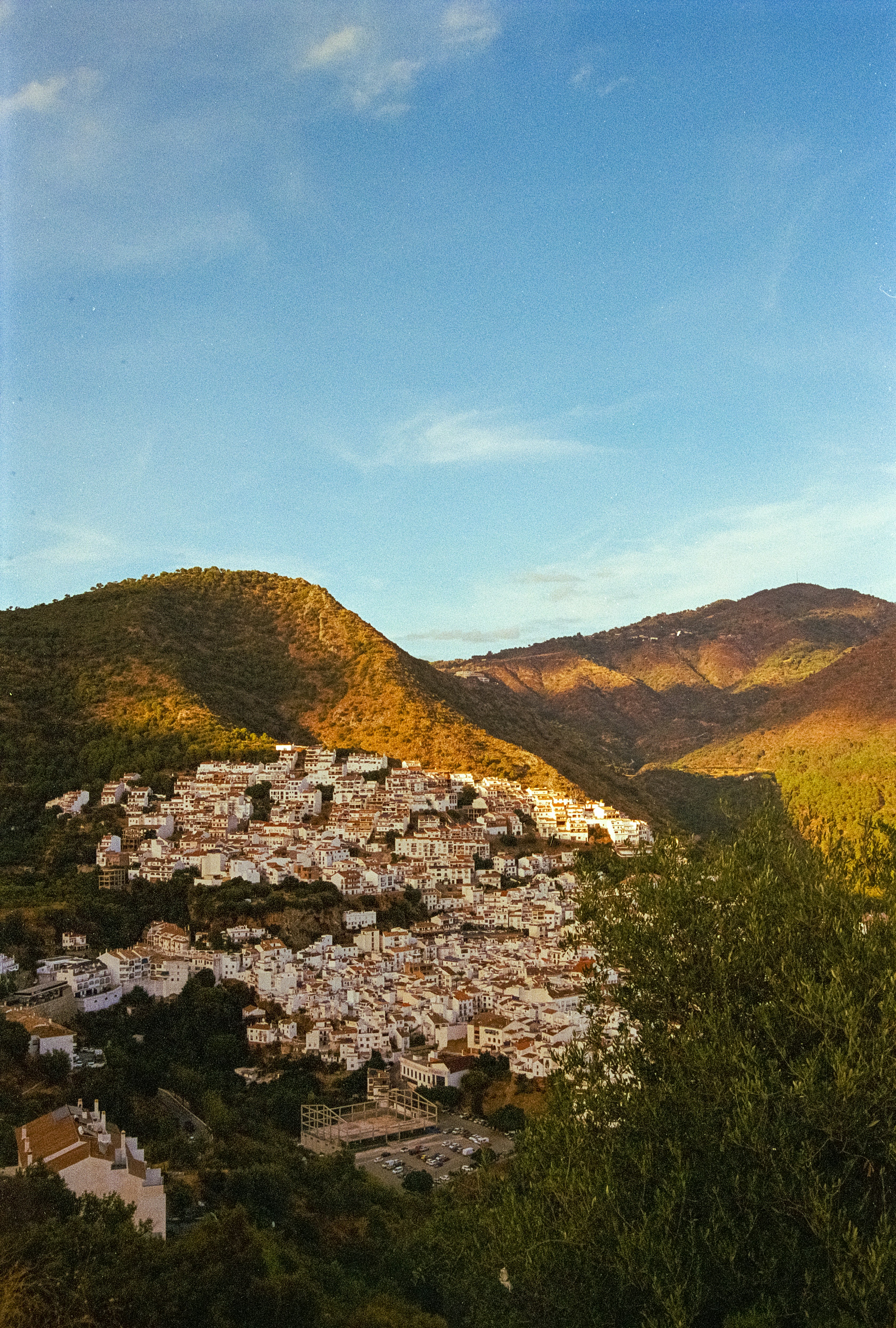 Sunlit White-Washed Village Clinging to a Mountain Amphitheatre