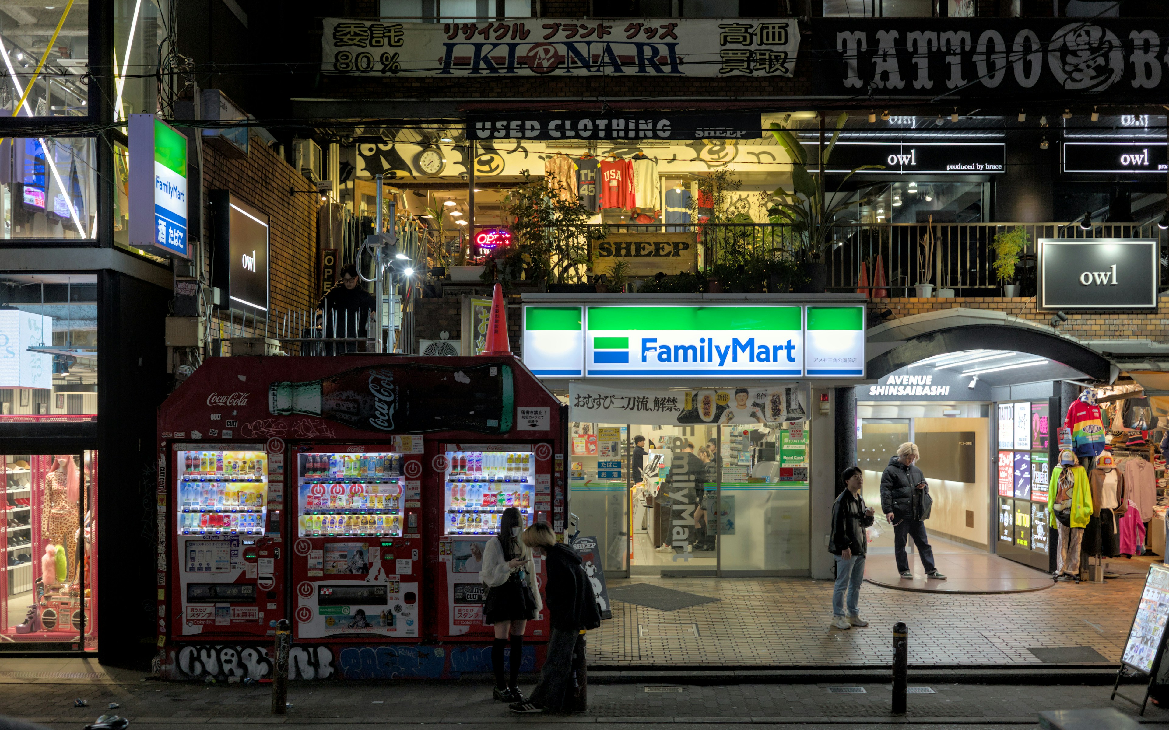 Nighttime street scene with shops and people. photo – Free City Image ...