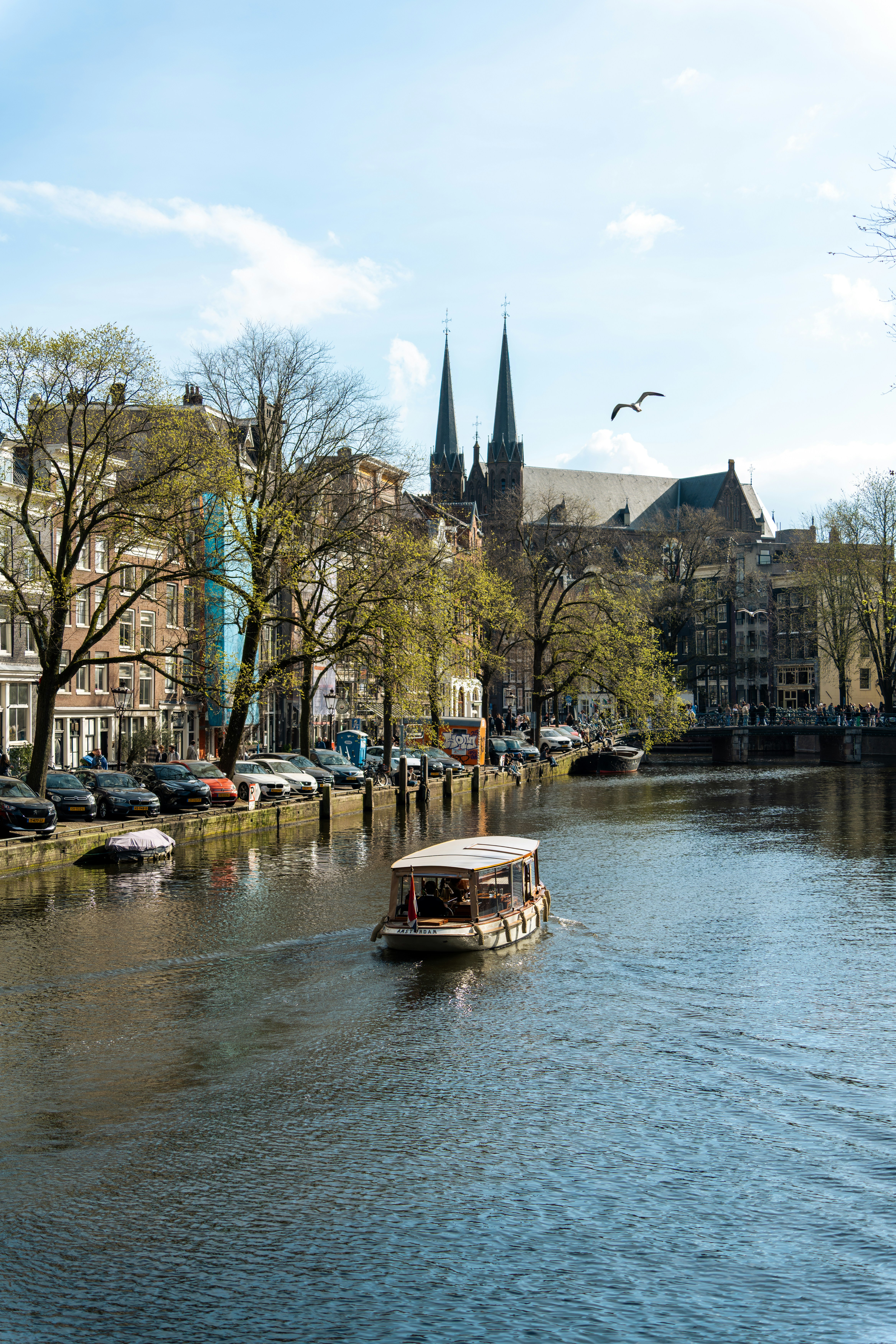 Boat sails in a canal in Amsterdam