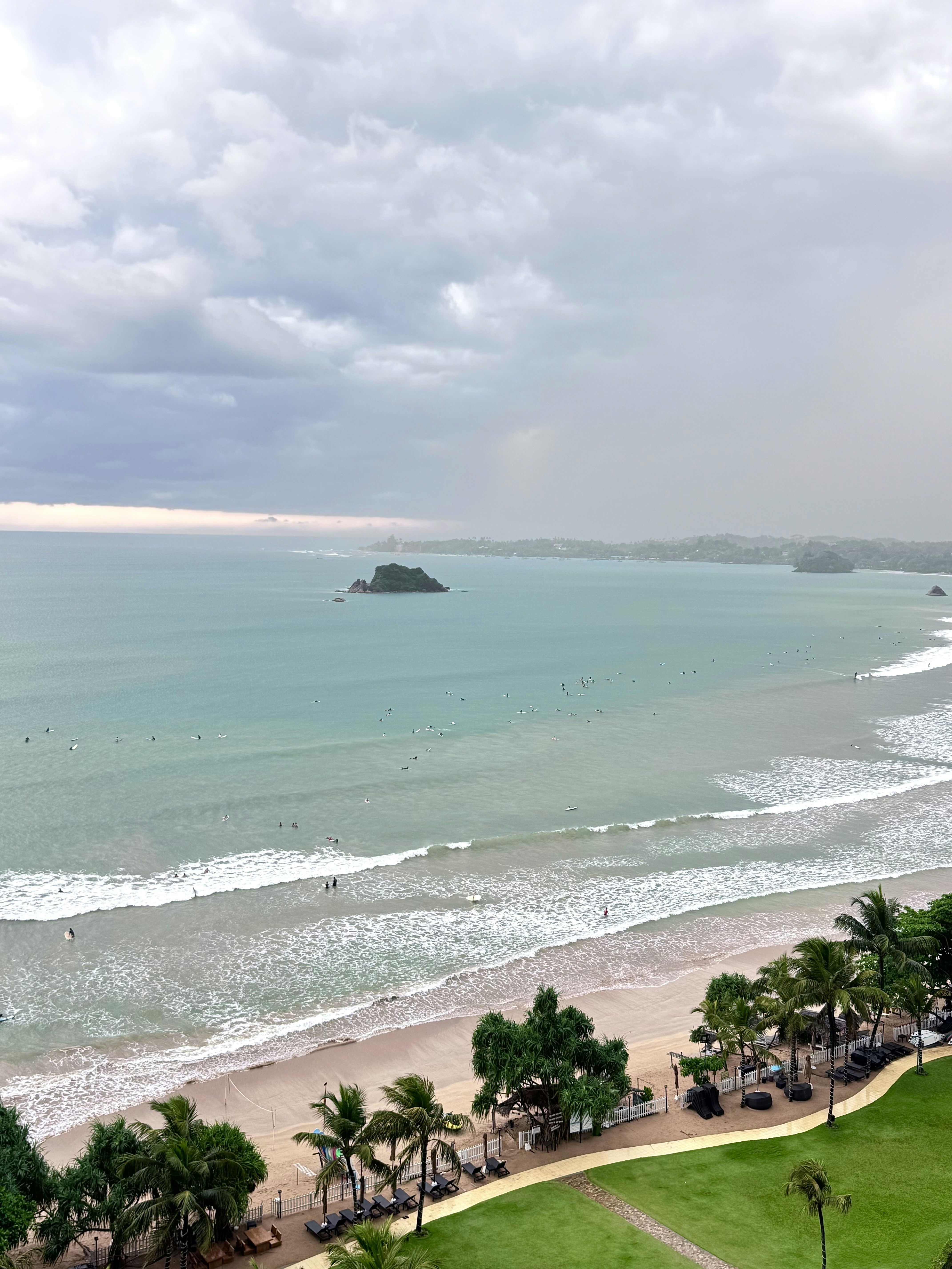 Beach with light blue water and cloudy skies. photo – Free Surf Image ...