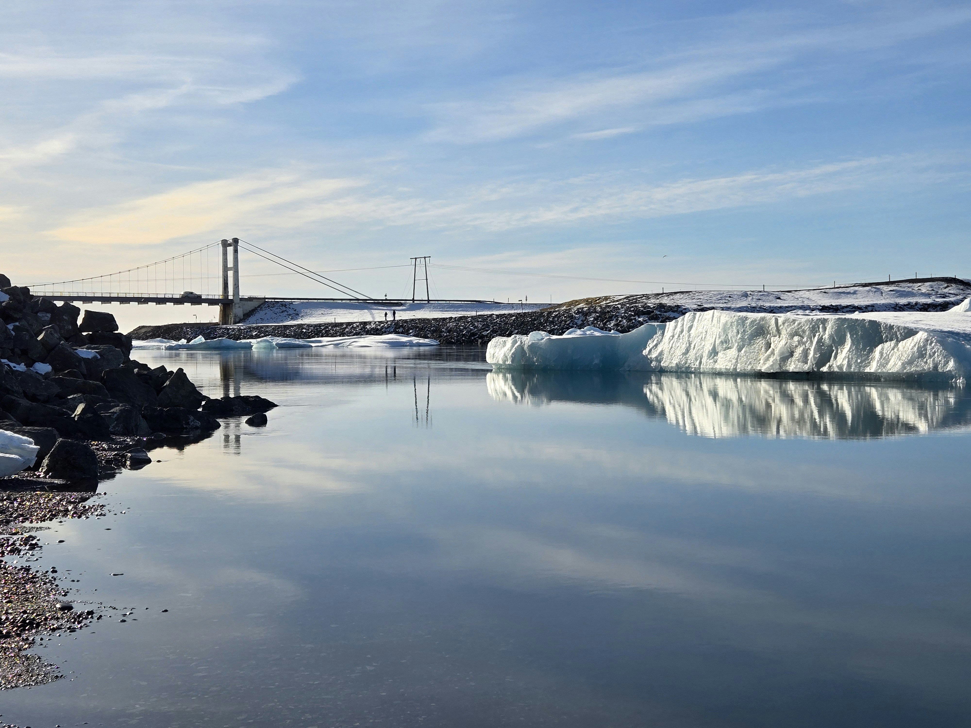 Mute Blues: Cable-Stayed Bridge Framed by Arctic Ice Floes