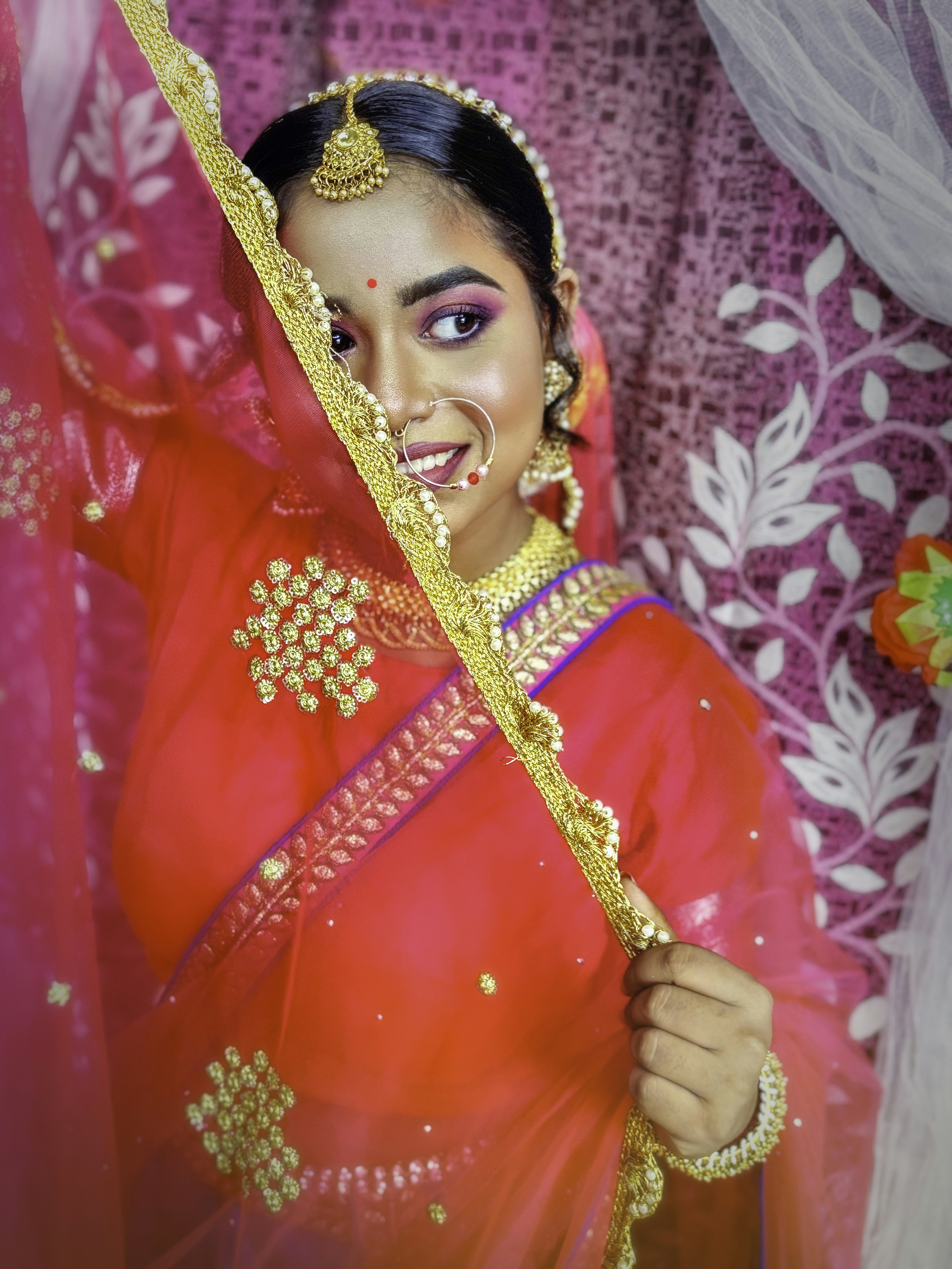 A bride peeking through a red veil. photo – Free Indian wedding Image ...
