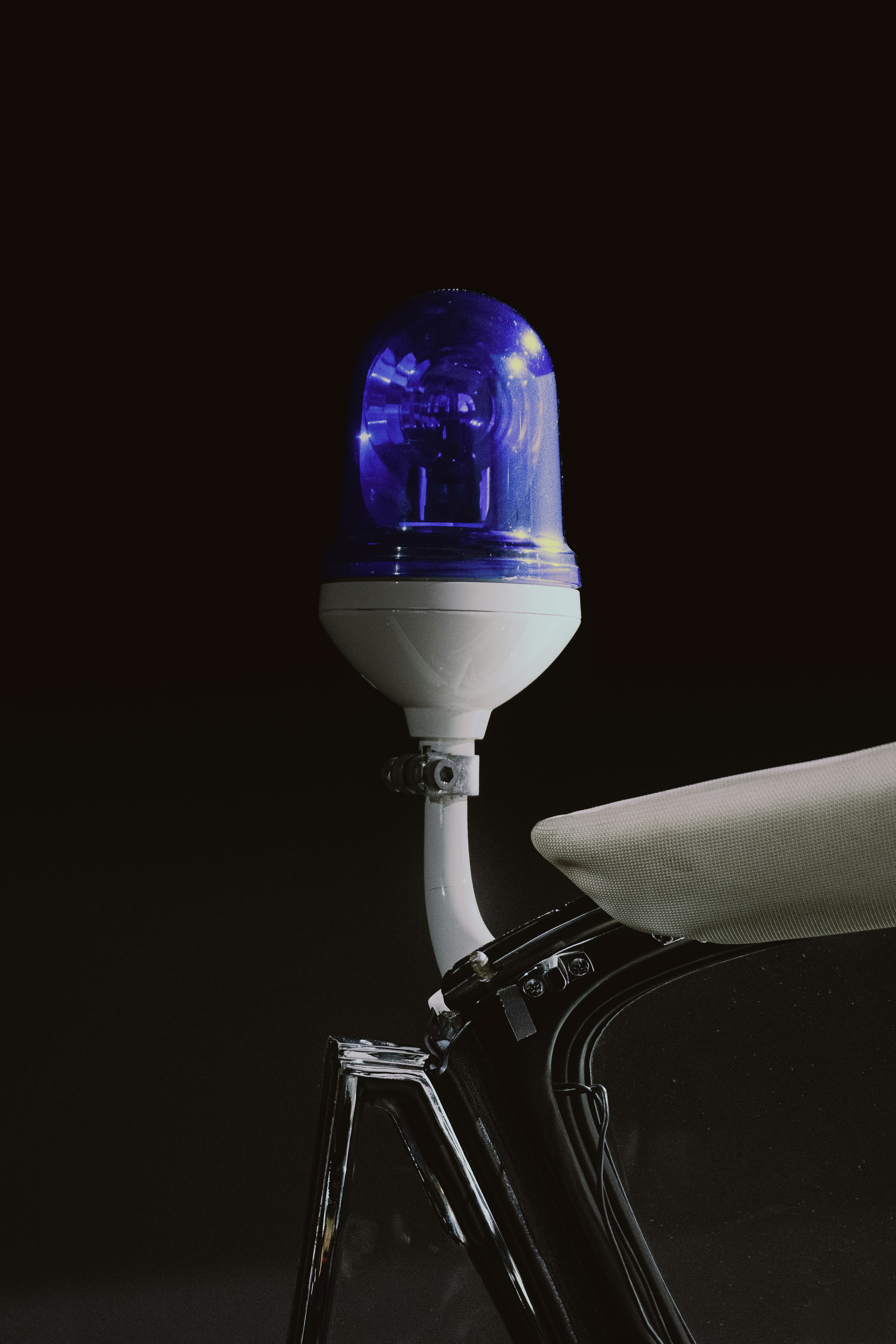 Blue Beacon on a Velvet Night: A Vintage Chrome Silhouette