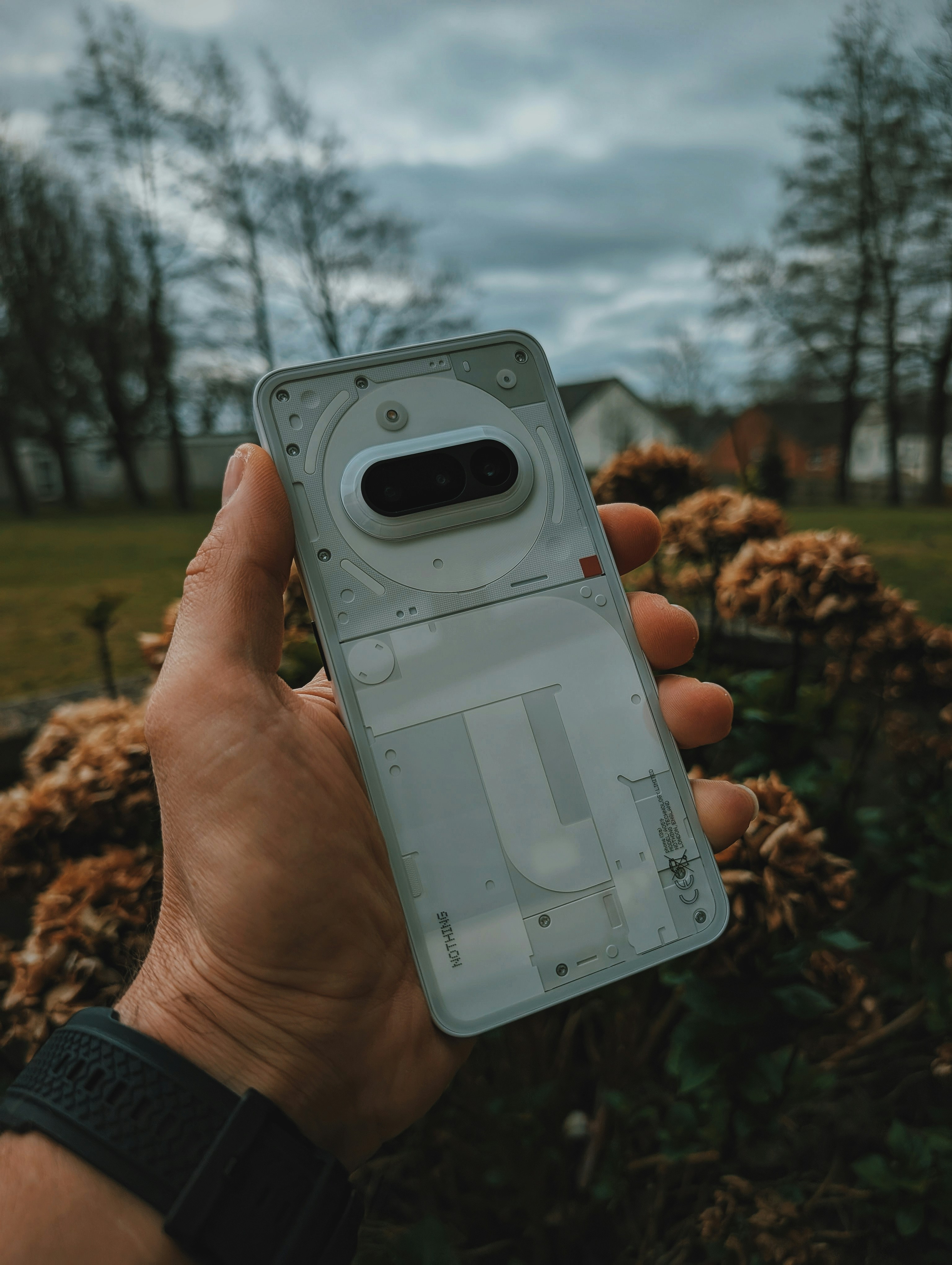 A hand holds a unique, transparent smartphone. photo – Free Phone Image ...