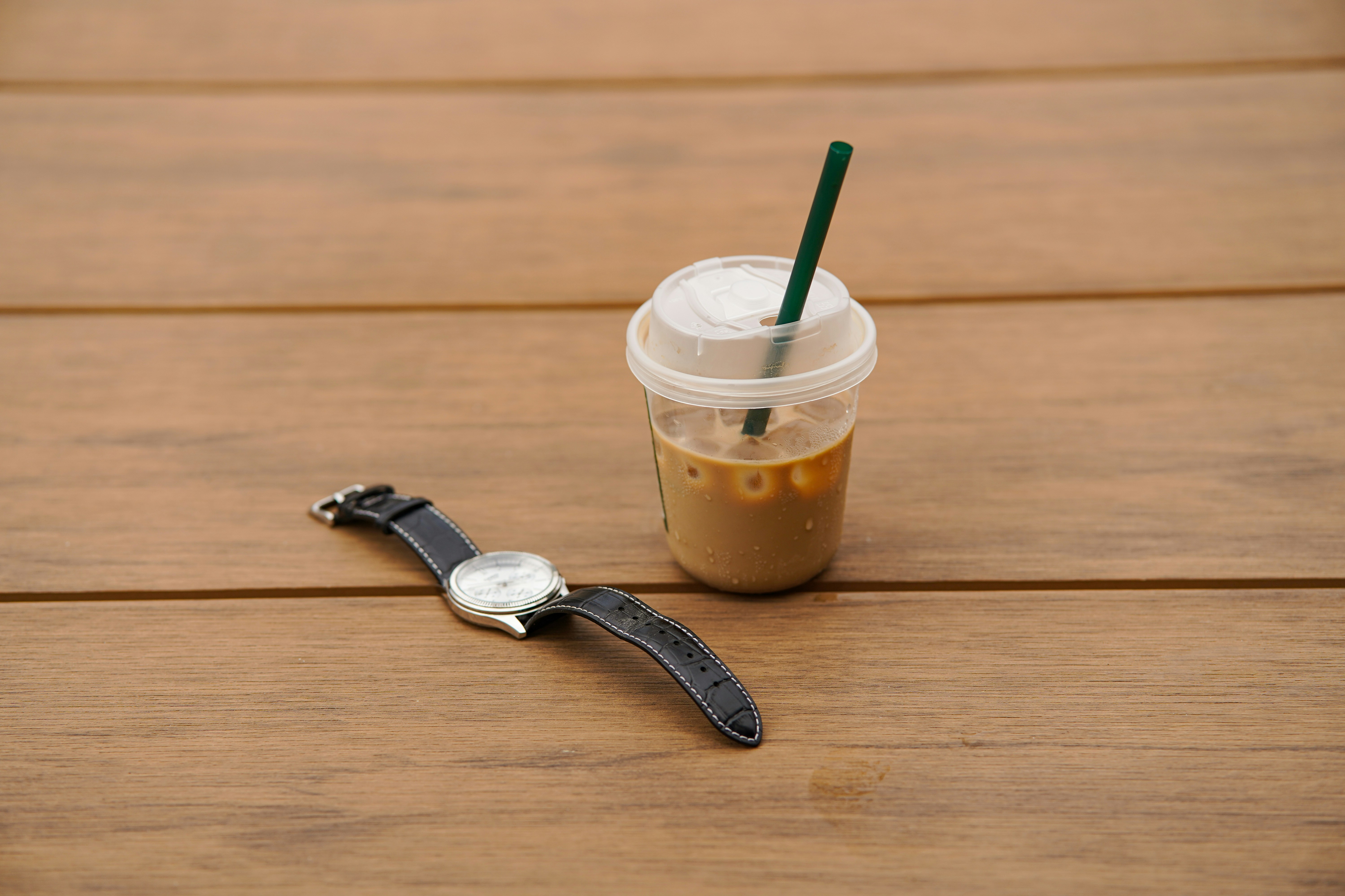 Cold Brew and Time: A Quiet Moment on Wooden Planks