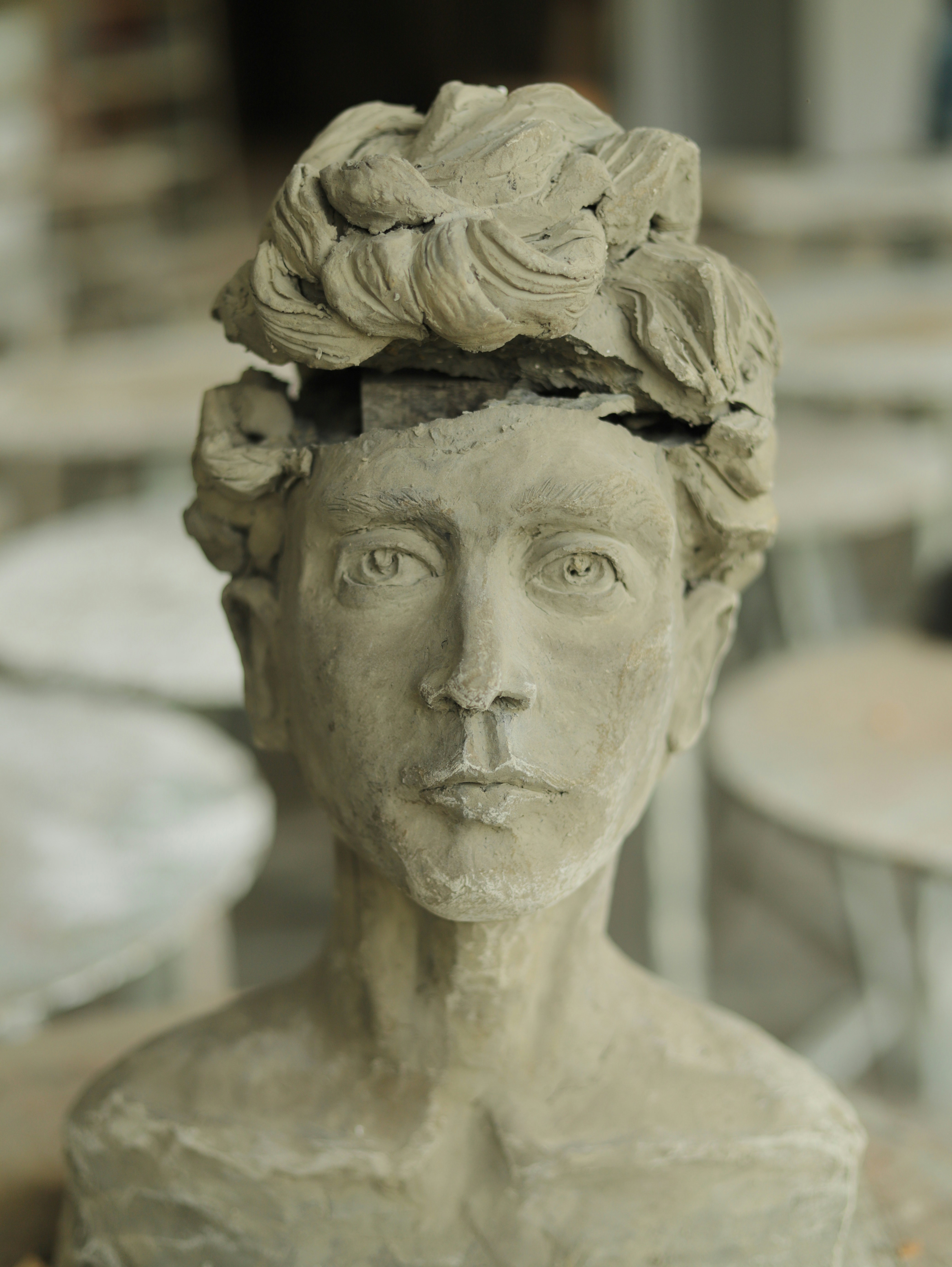A clay bust of a woman with elaborate hair. photo – Free Woman Image on ...