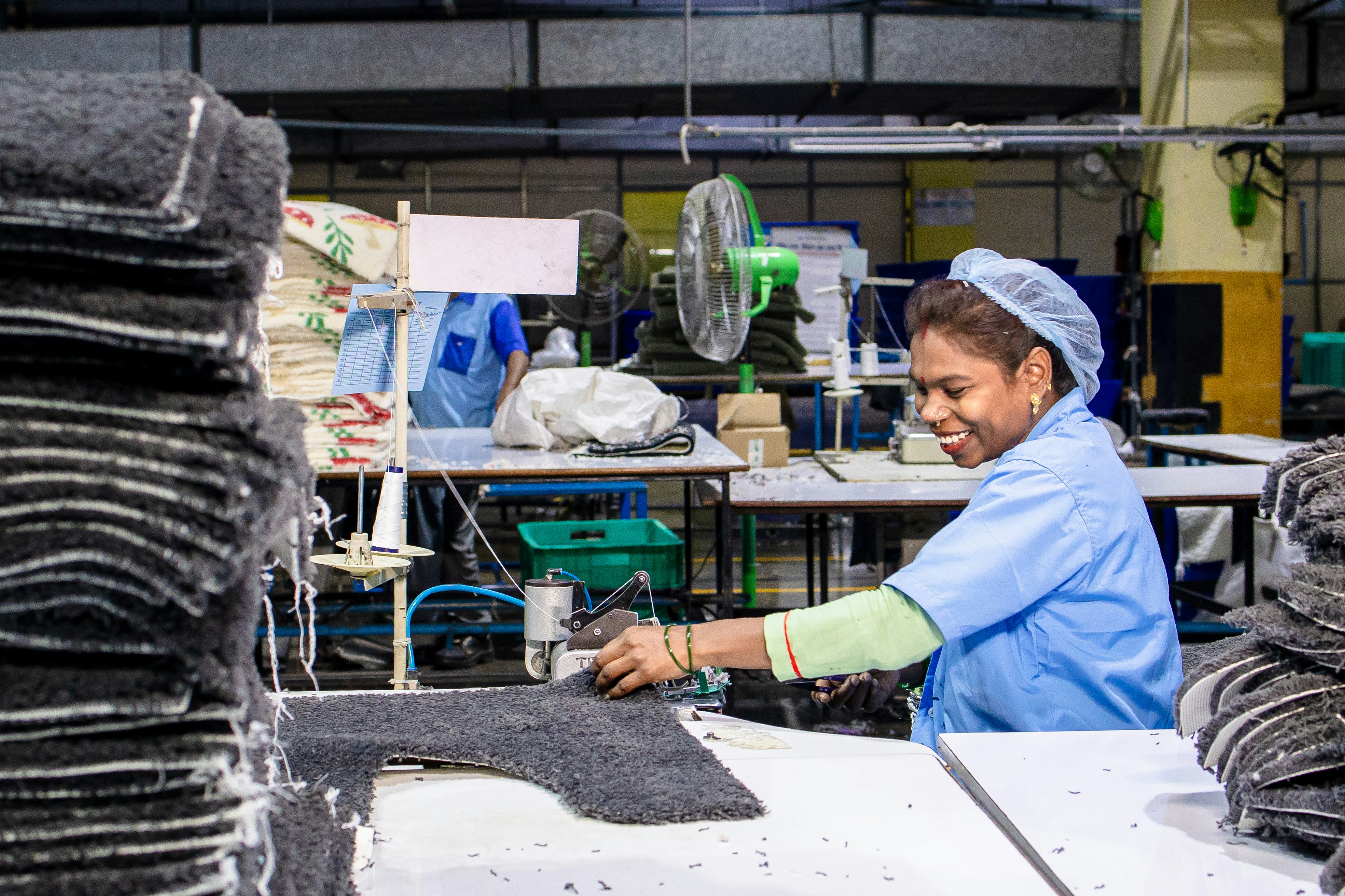 Focused Joy on the Factory Floor: A Textile Worker at the Cutting Table