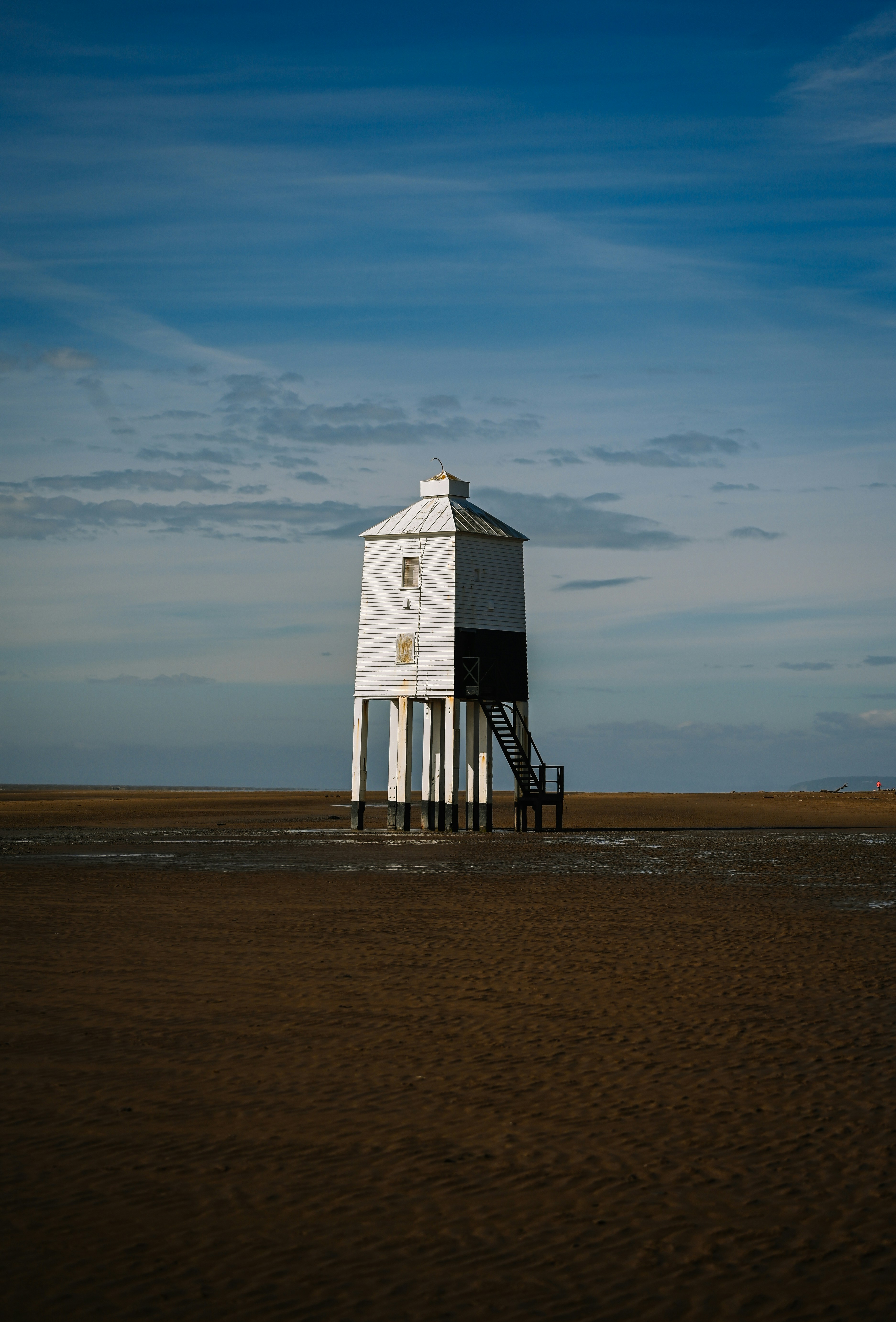 Solitary Lighthouse on the Vast SeashoreNik