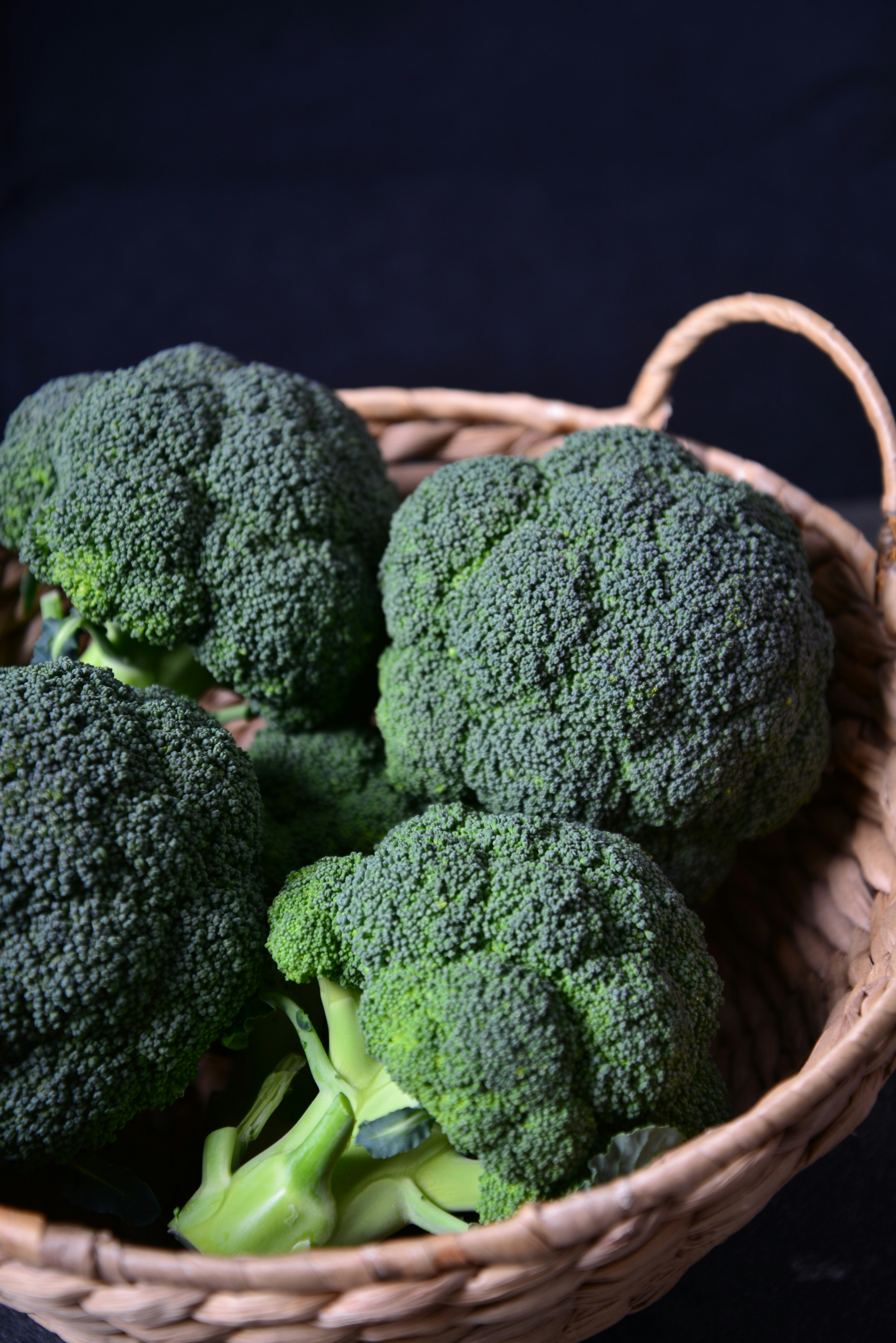 Emerald Crowns in a Wicker Basket: A Textured Broccoli Still-Life