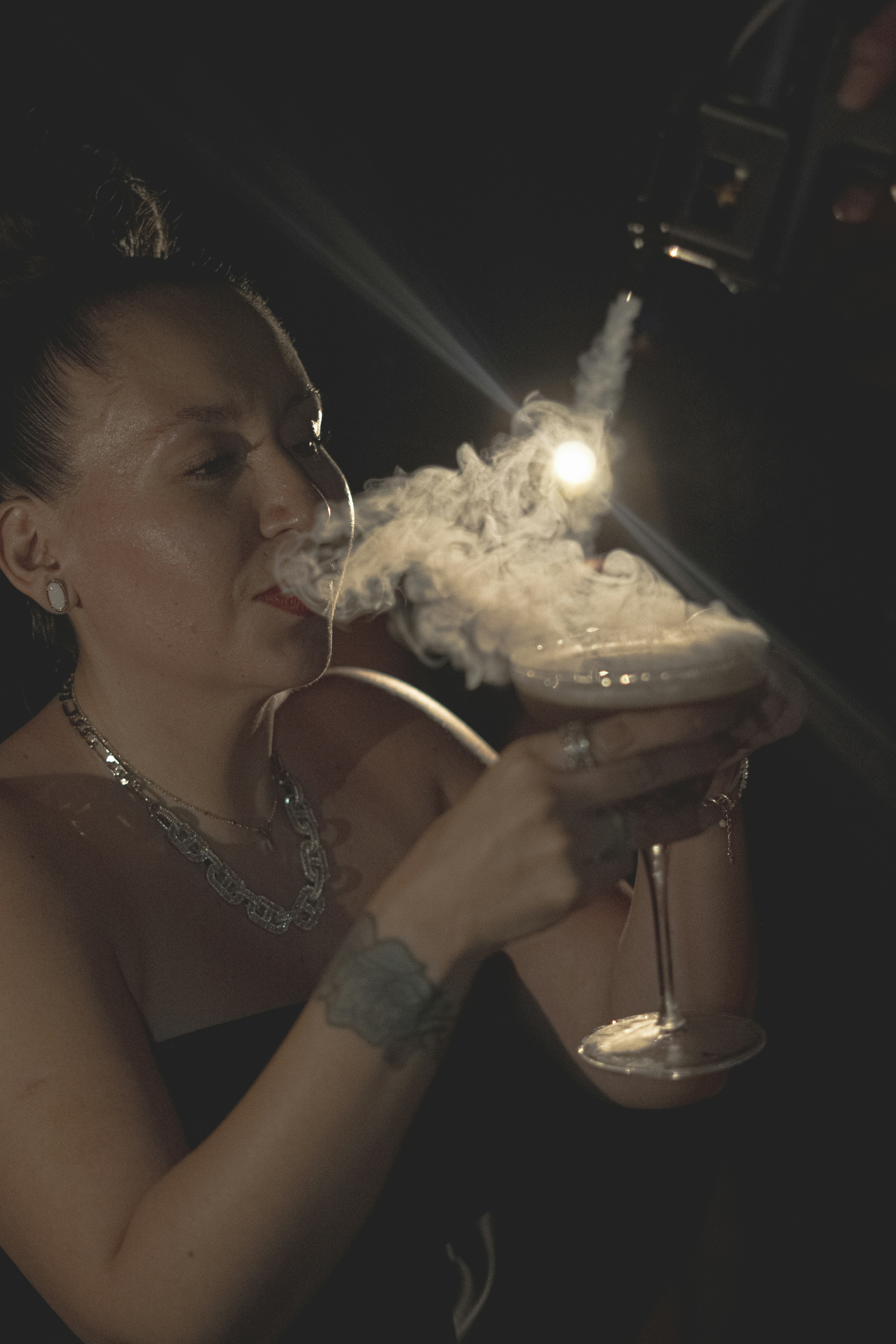 Whispers of Elegance: A Smoky Cocktail Moment