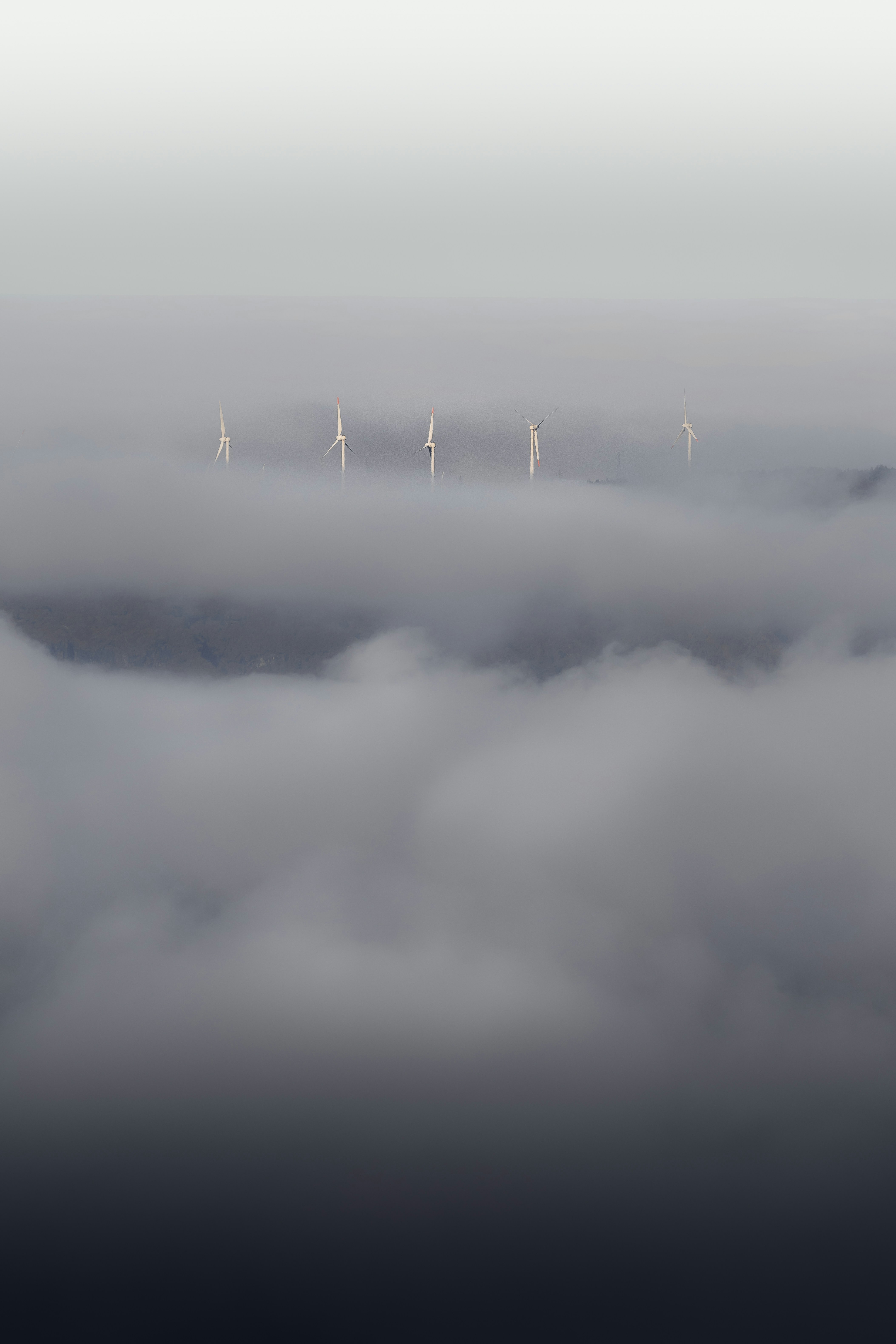Whispers of Wind: Turbines Amidst the Clouds