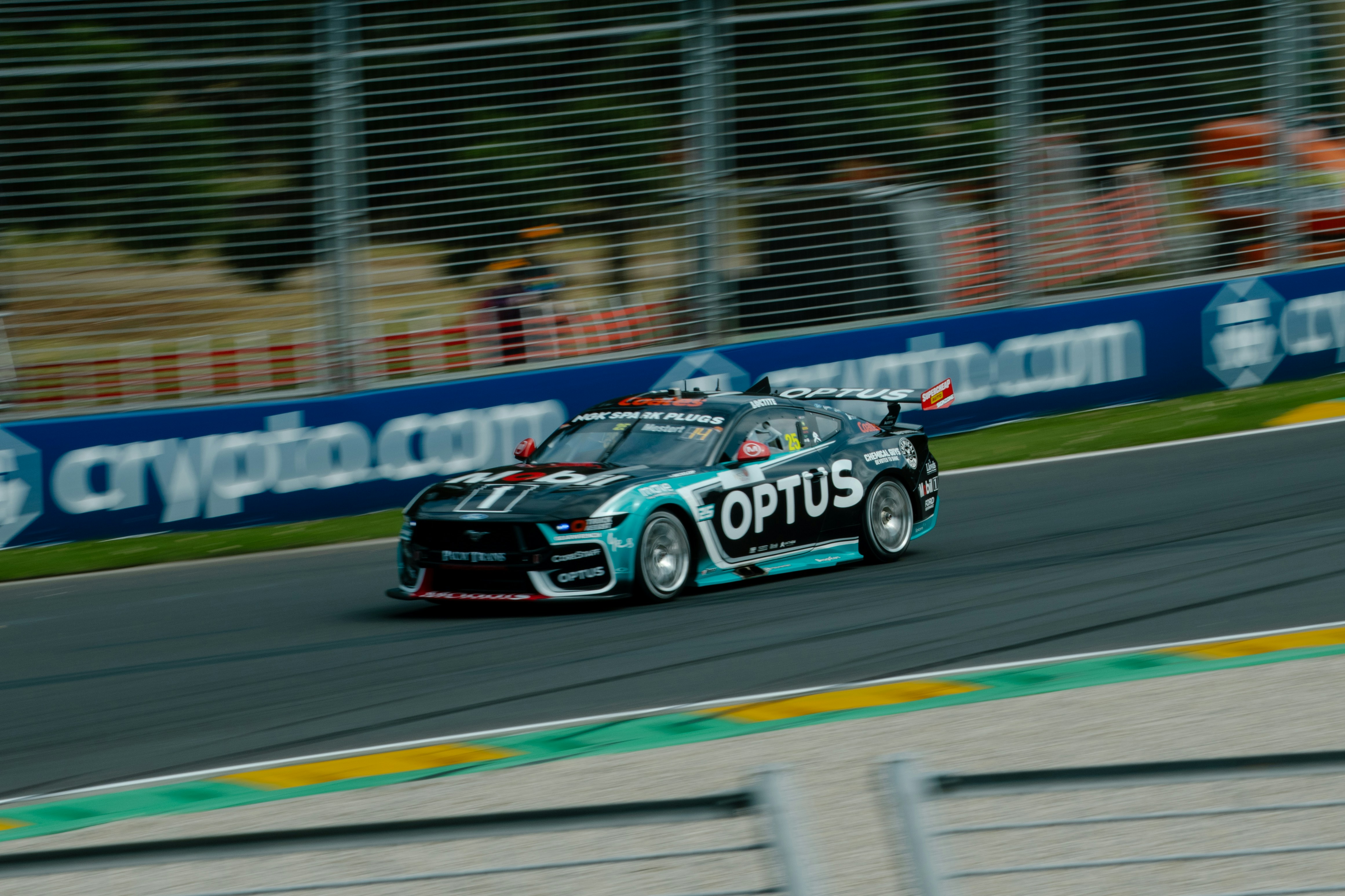 Race car speeding around the track during a race. photo – Free ...