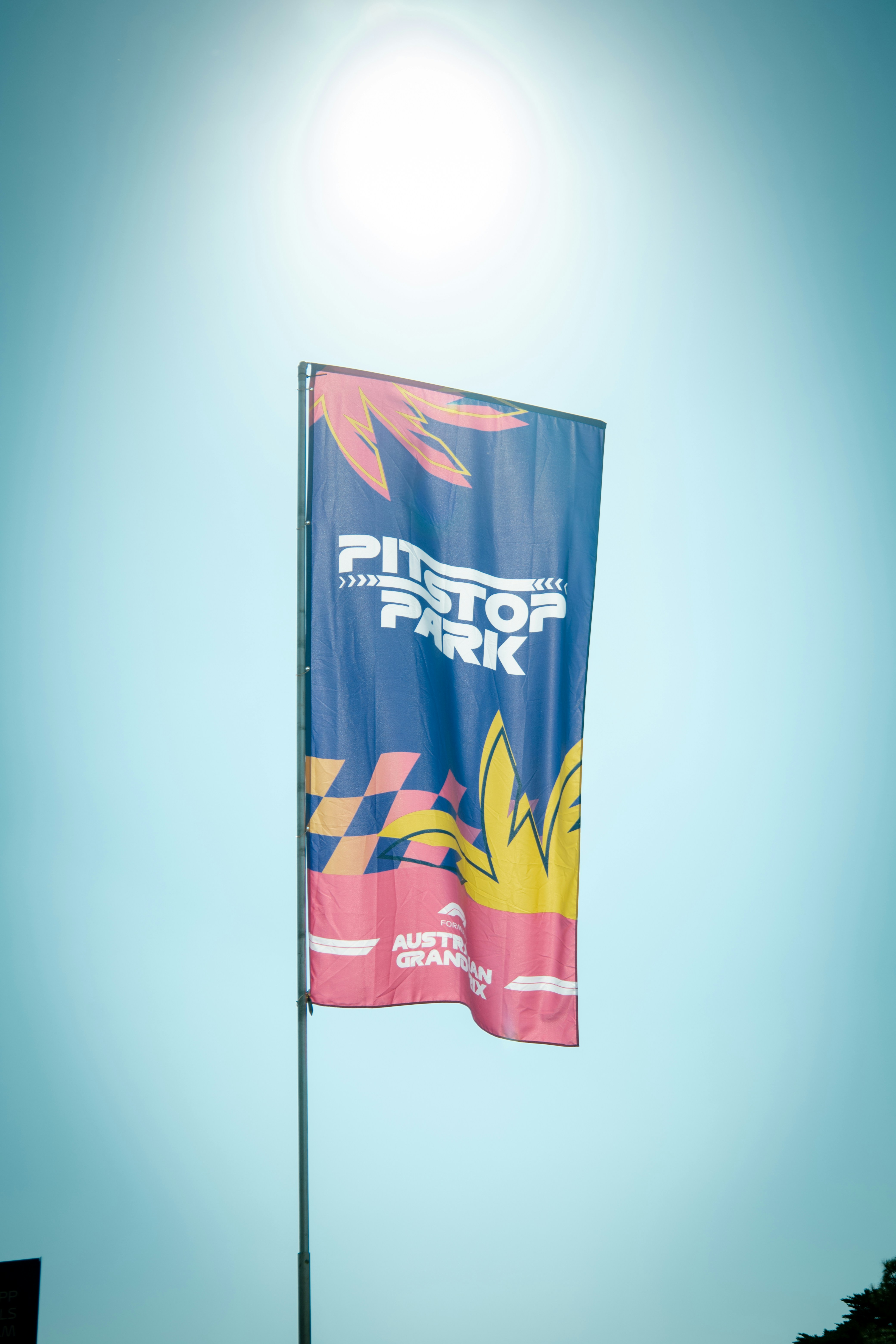 A flag displays the pit stop park logo. photo – Free Australia Image on ...