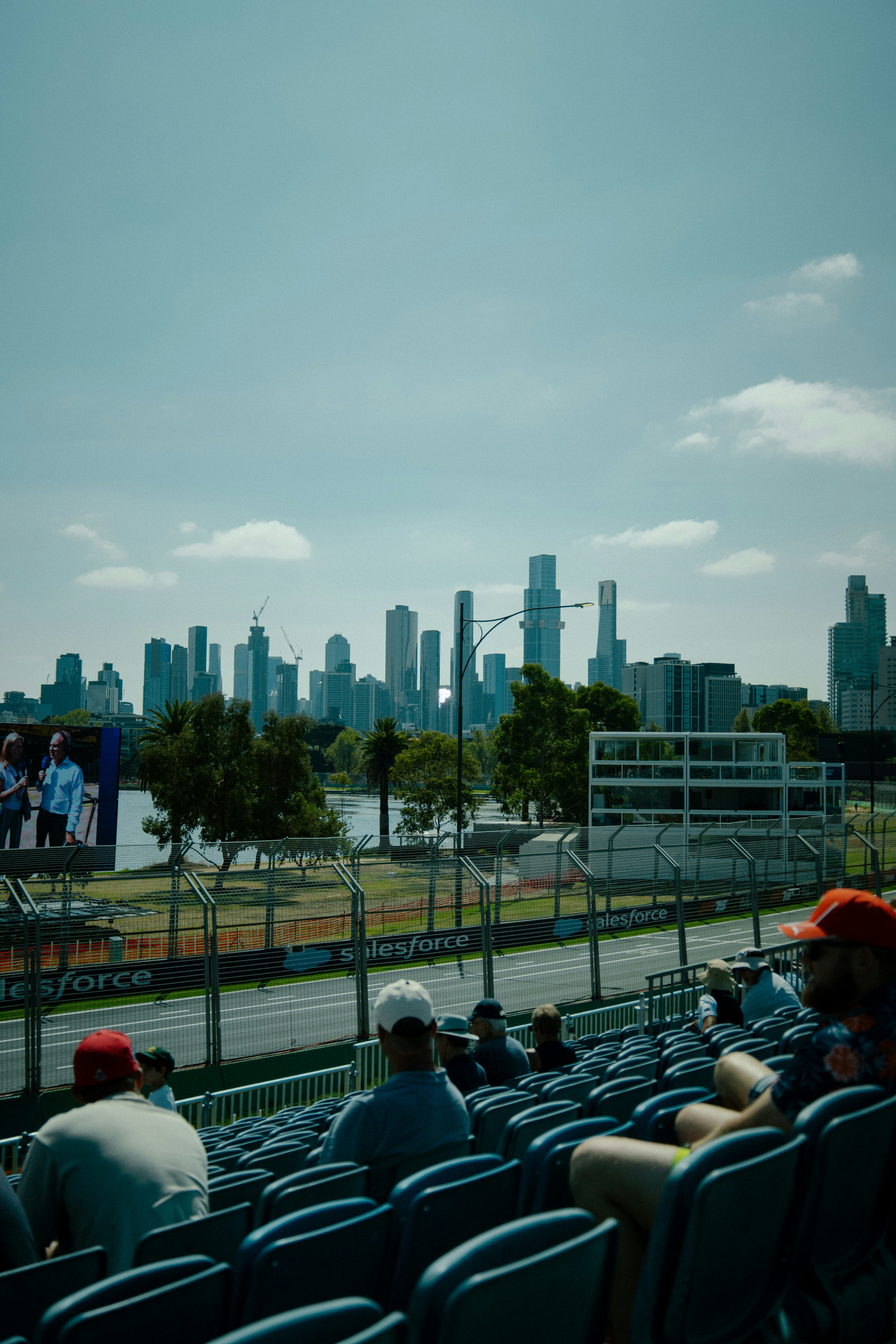 City Skyline Behind a Half-Full Stadium
