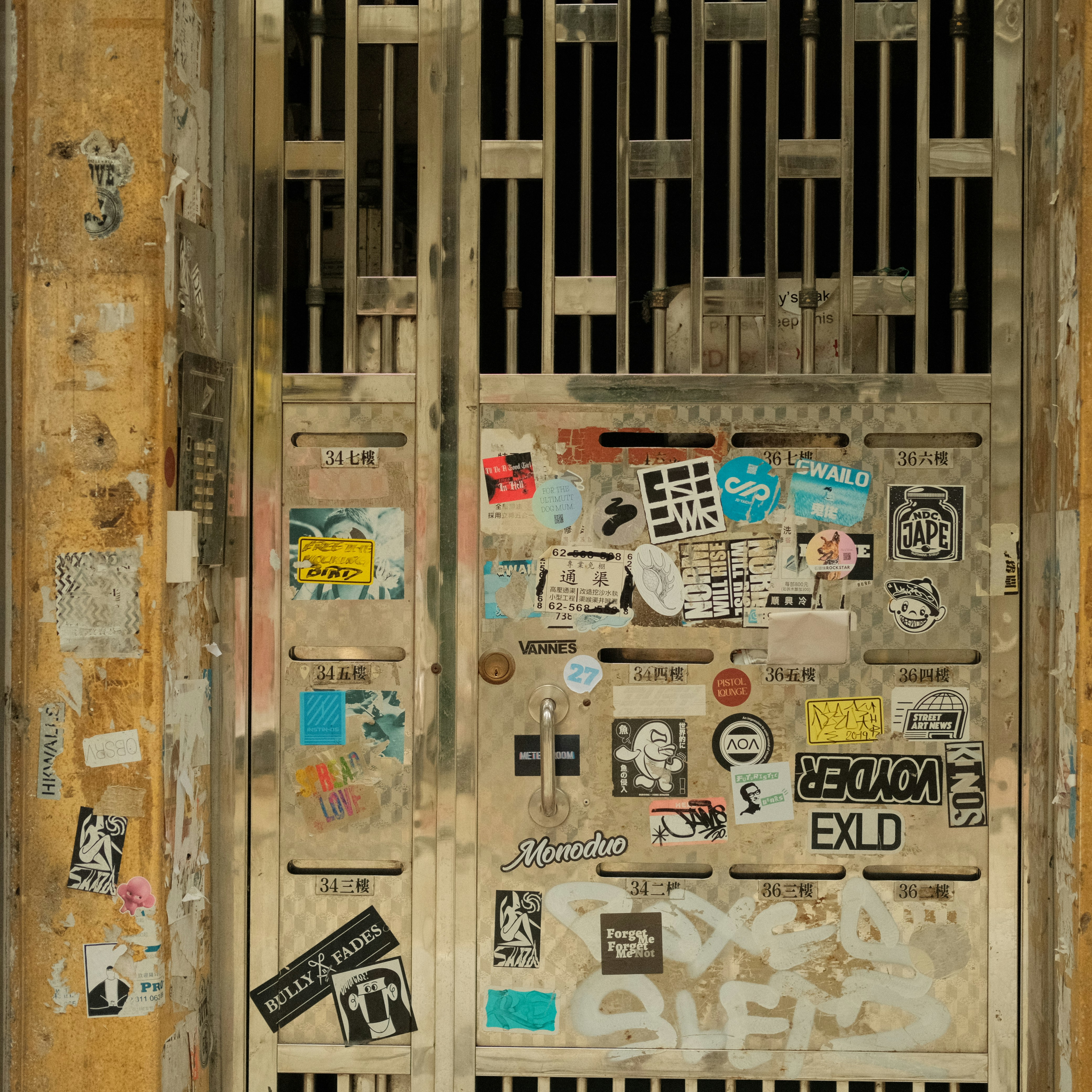 Stickered Gate: An Urban Collage of Steel and Street Echoes