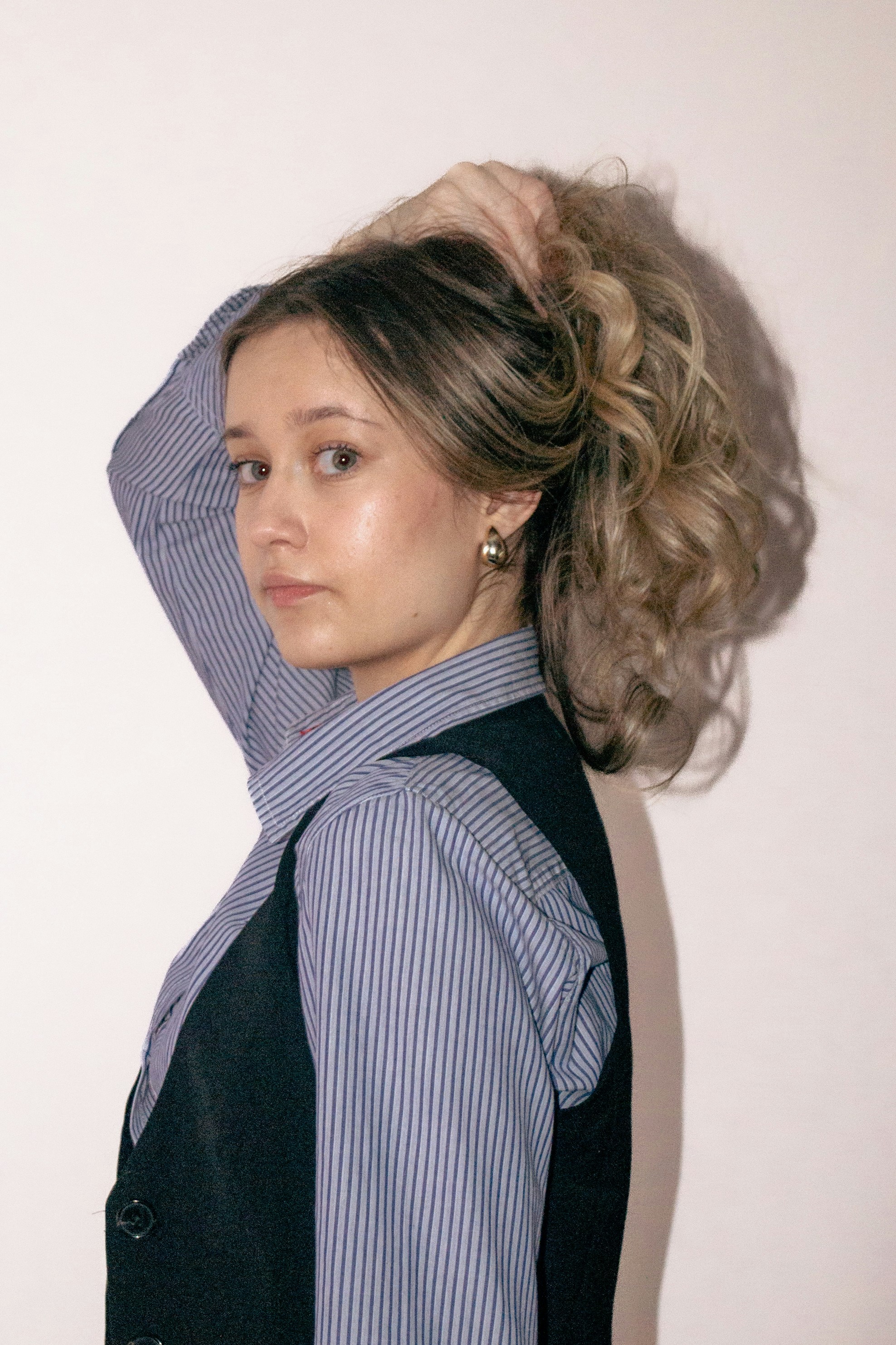 Stripes and Stillness: A Studio Portrait of Poised Determination