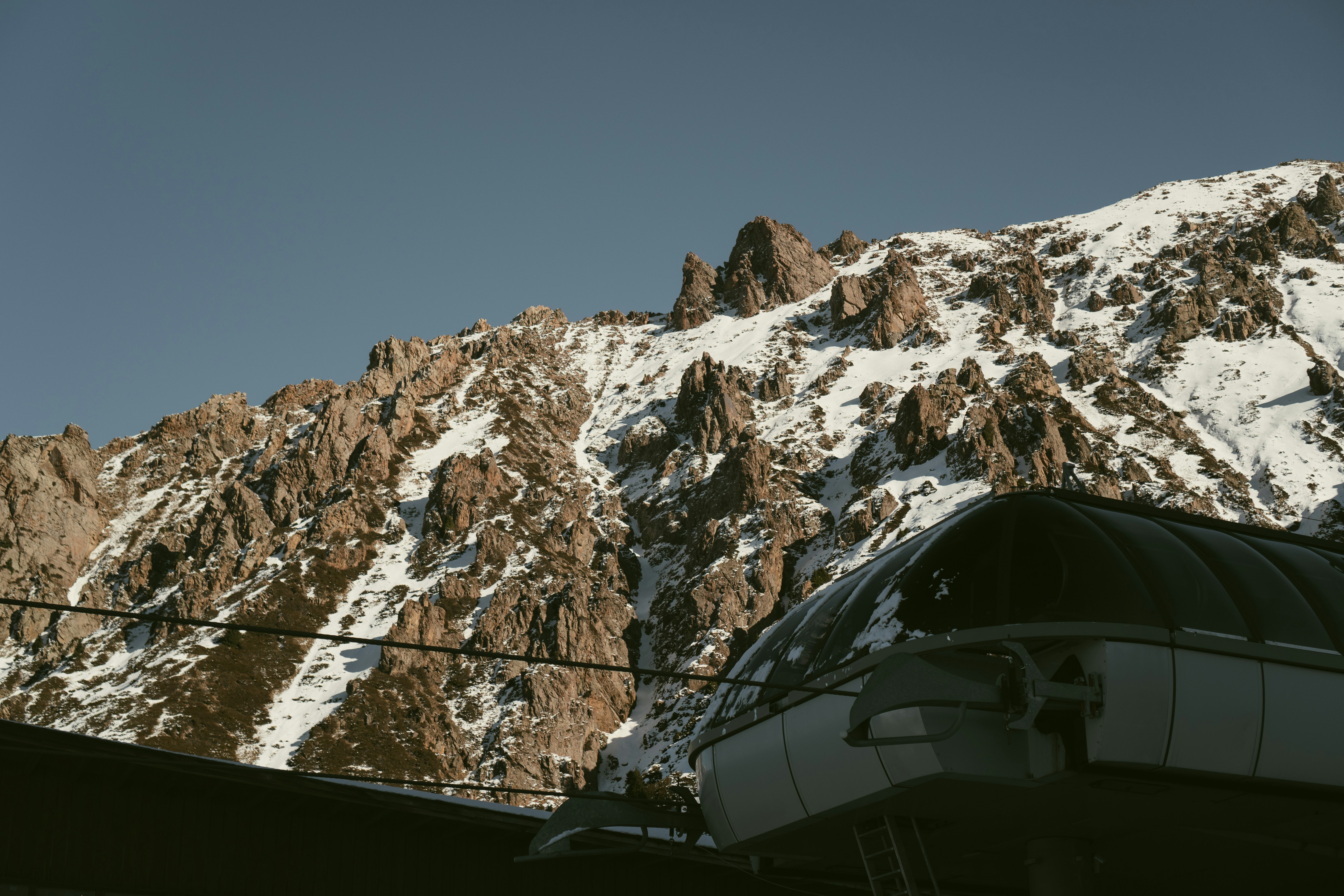 Winter Ascent: Cable Car's Journey to the Peaks