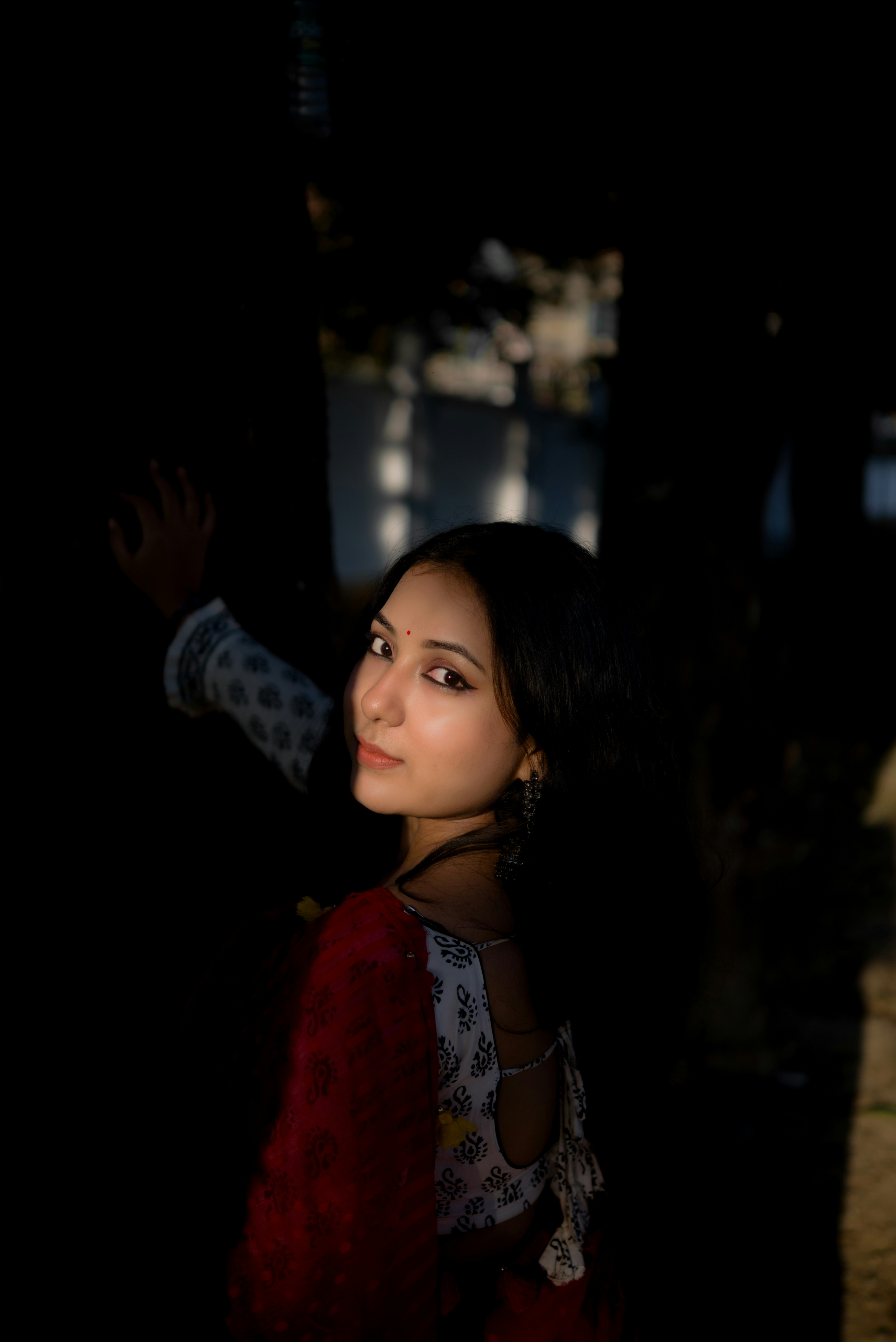 A woman poses, illuminated by sunlight. photo – Free Portrait Image on ...