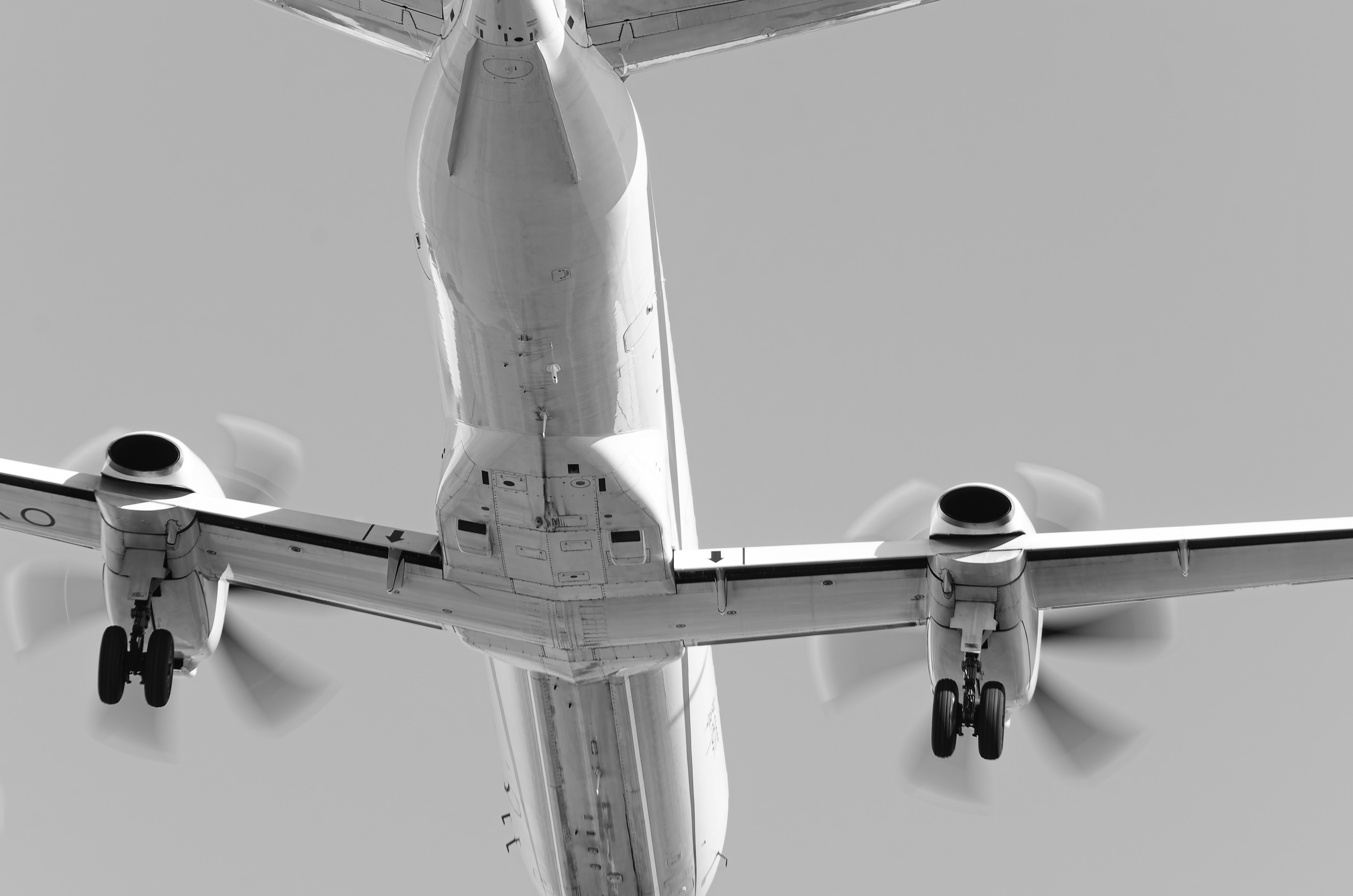 Airplane viewed from the bottom, propellers visible. photo – Free ...