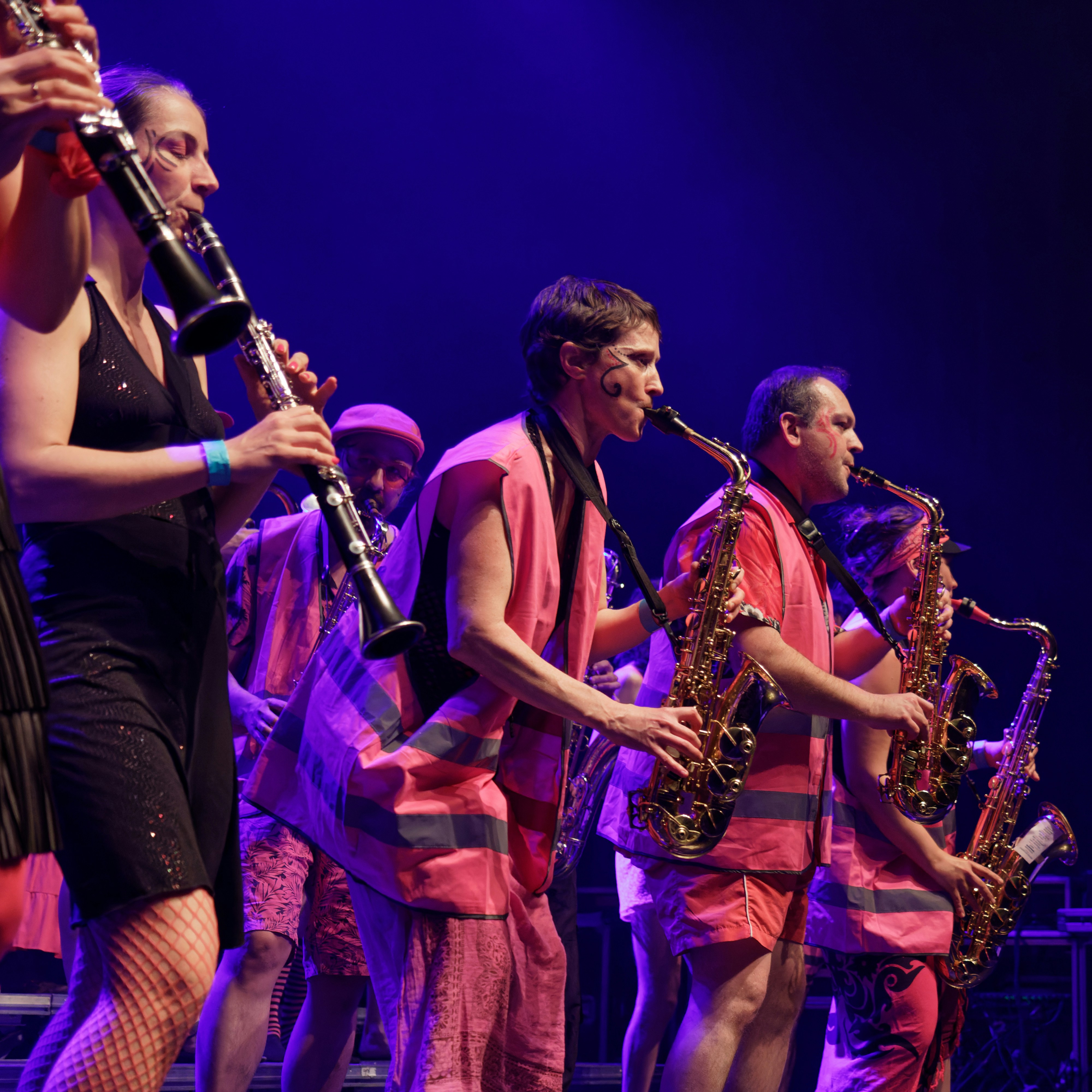 Saxons in Sunset: A Brass Ensemble in Neon Pink