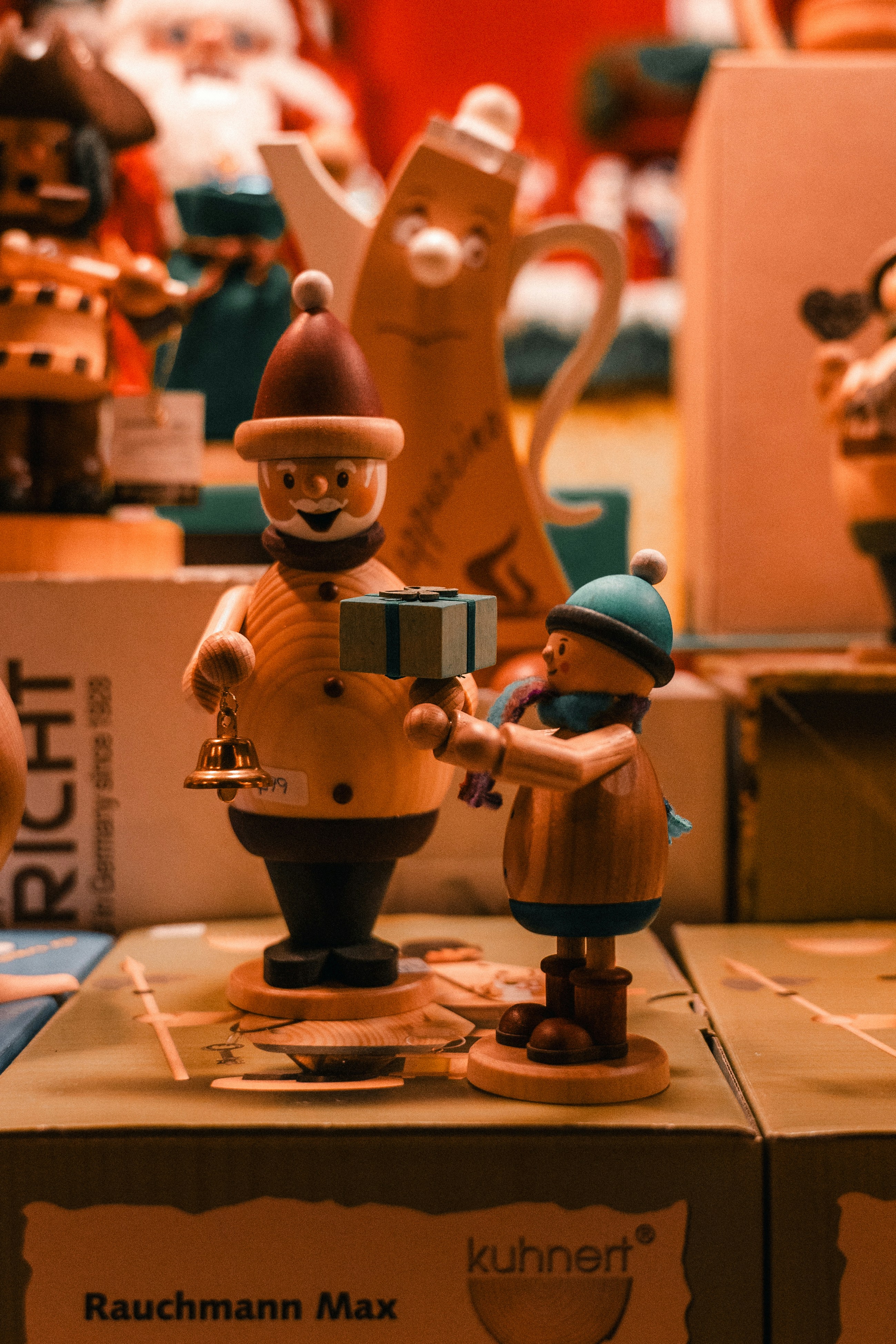Tiny Gift Exchange Among Wooden Holiday Figures