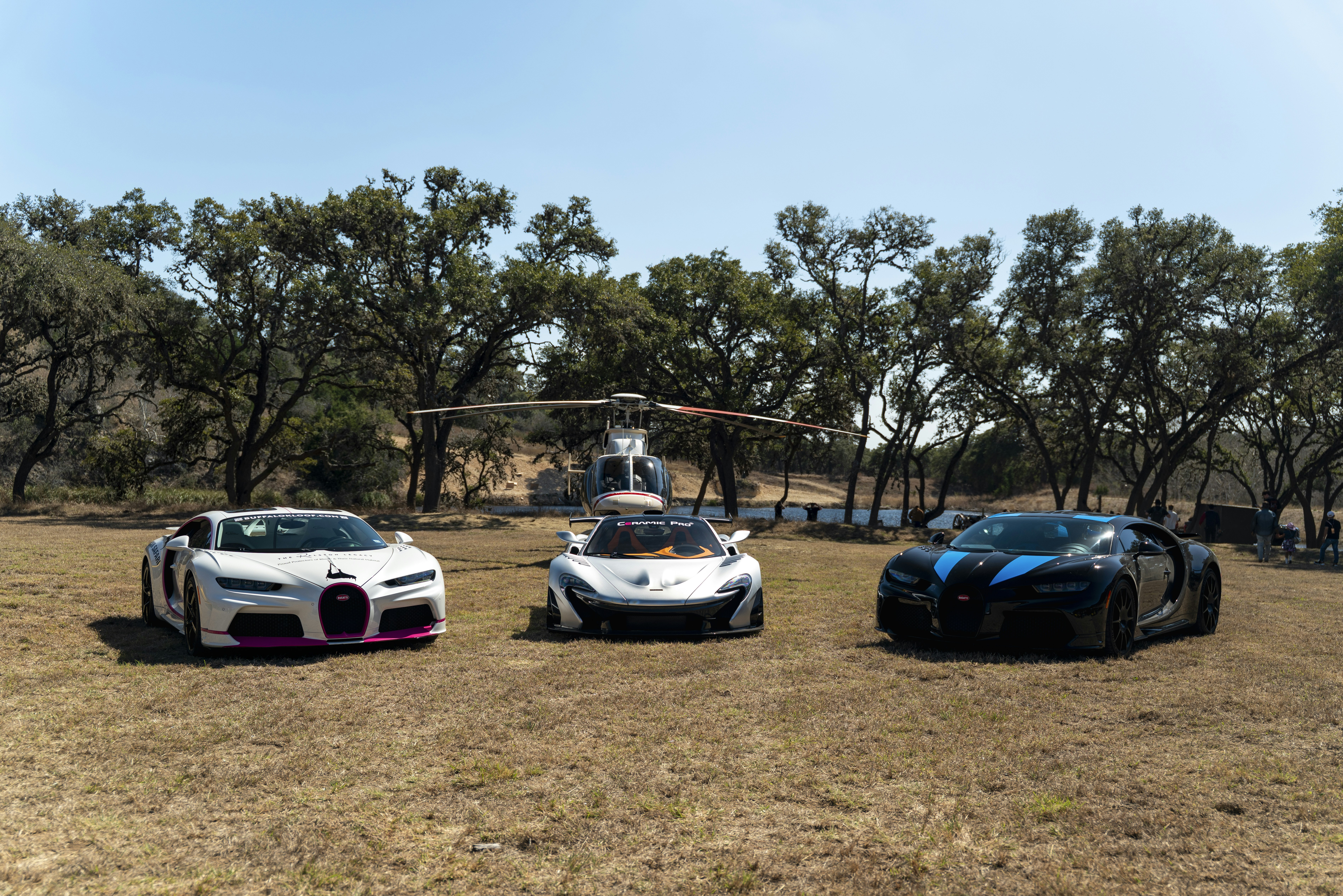 Three bugatti cars and a helicopter parked outside. photo – Free ...