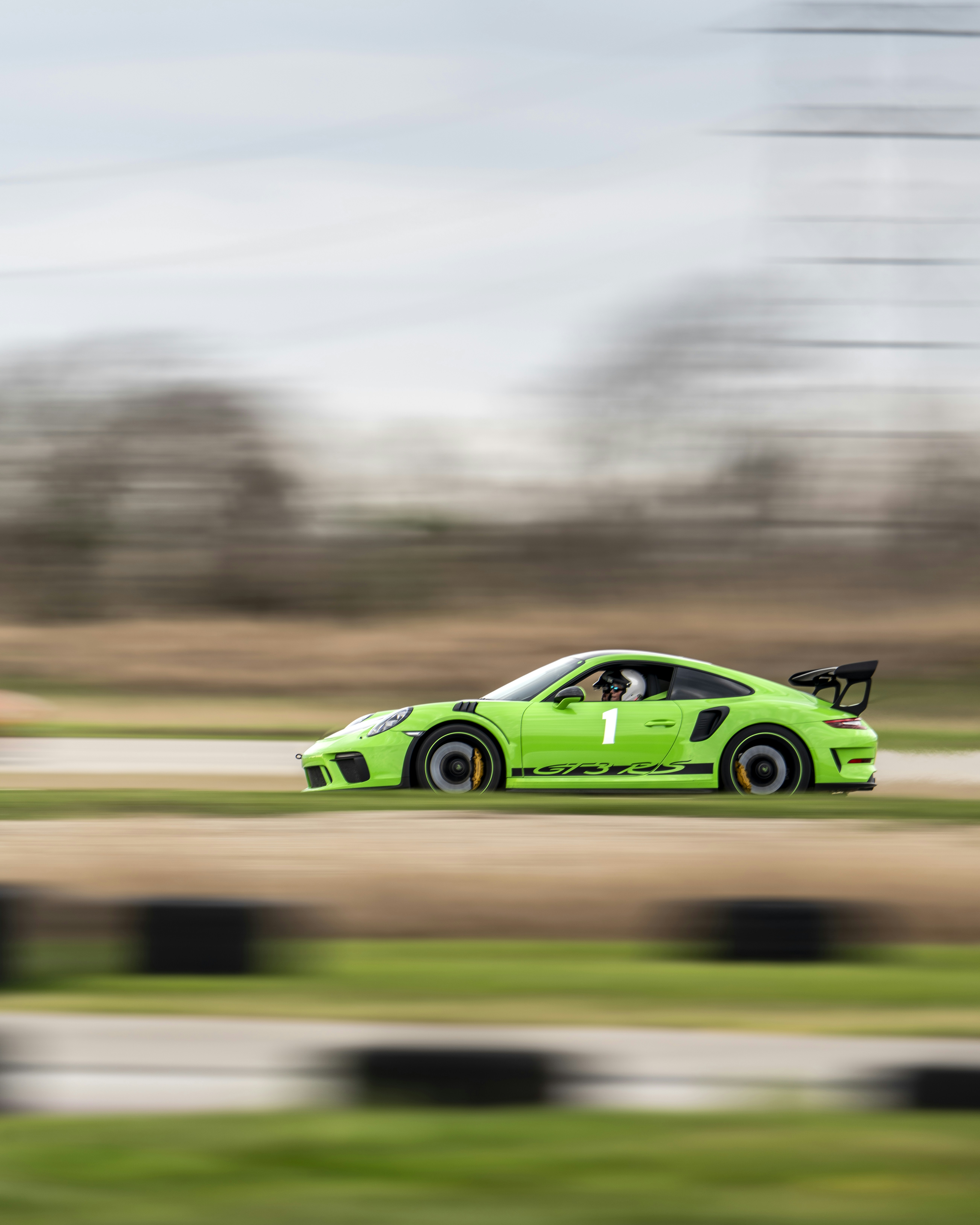 Lime Lightning: a green race car blazing along the track
