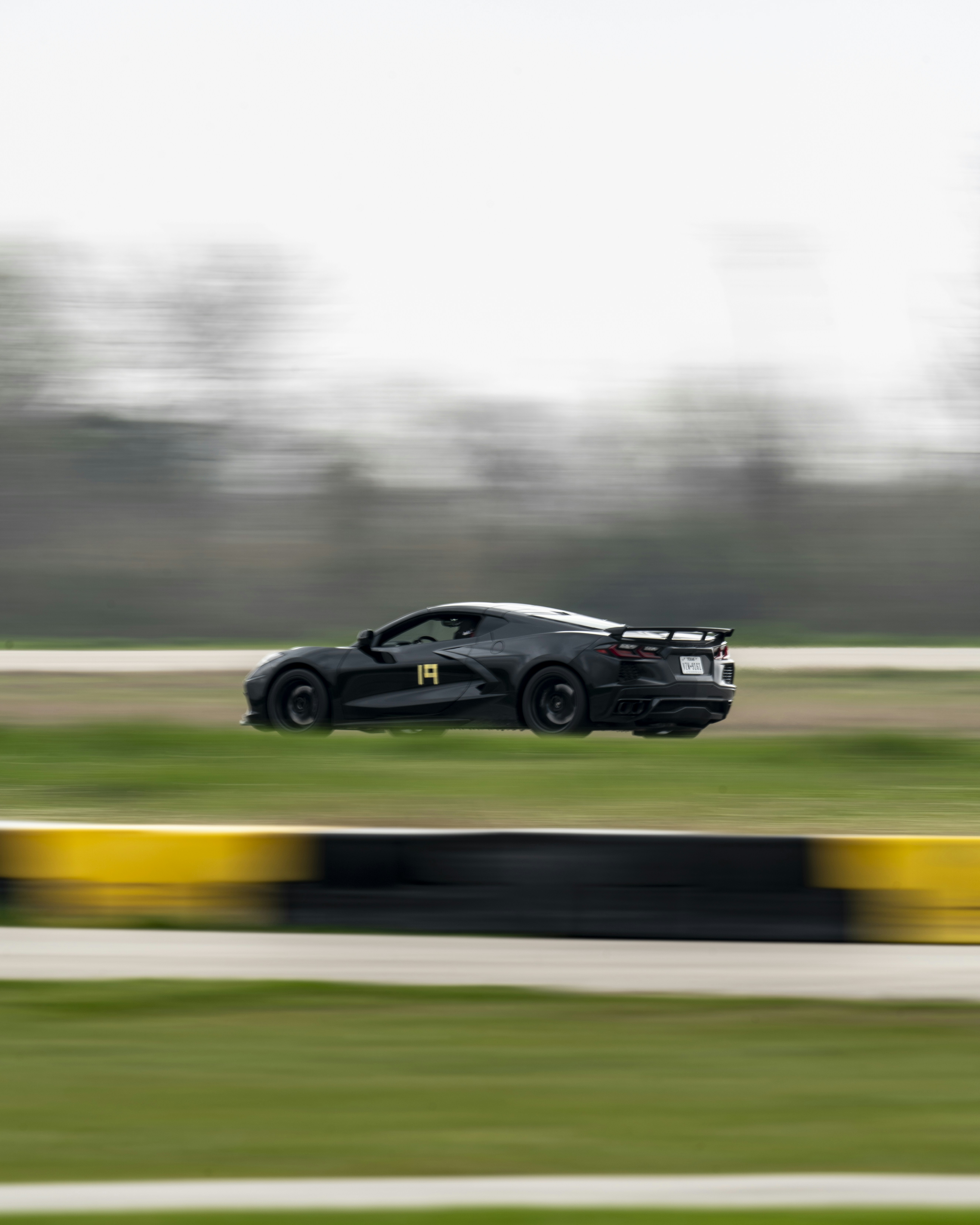 A fast corvette speeds on a racetrack. photo – Free Car Image on Unsplash