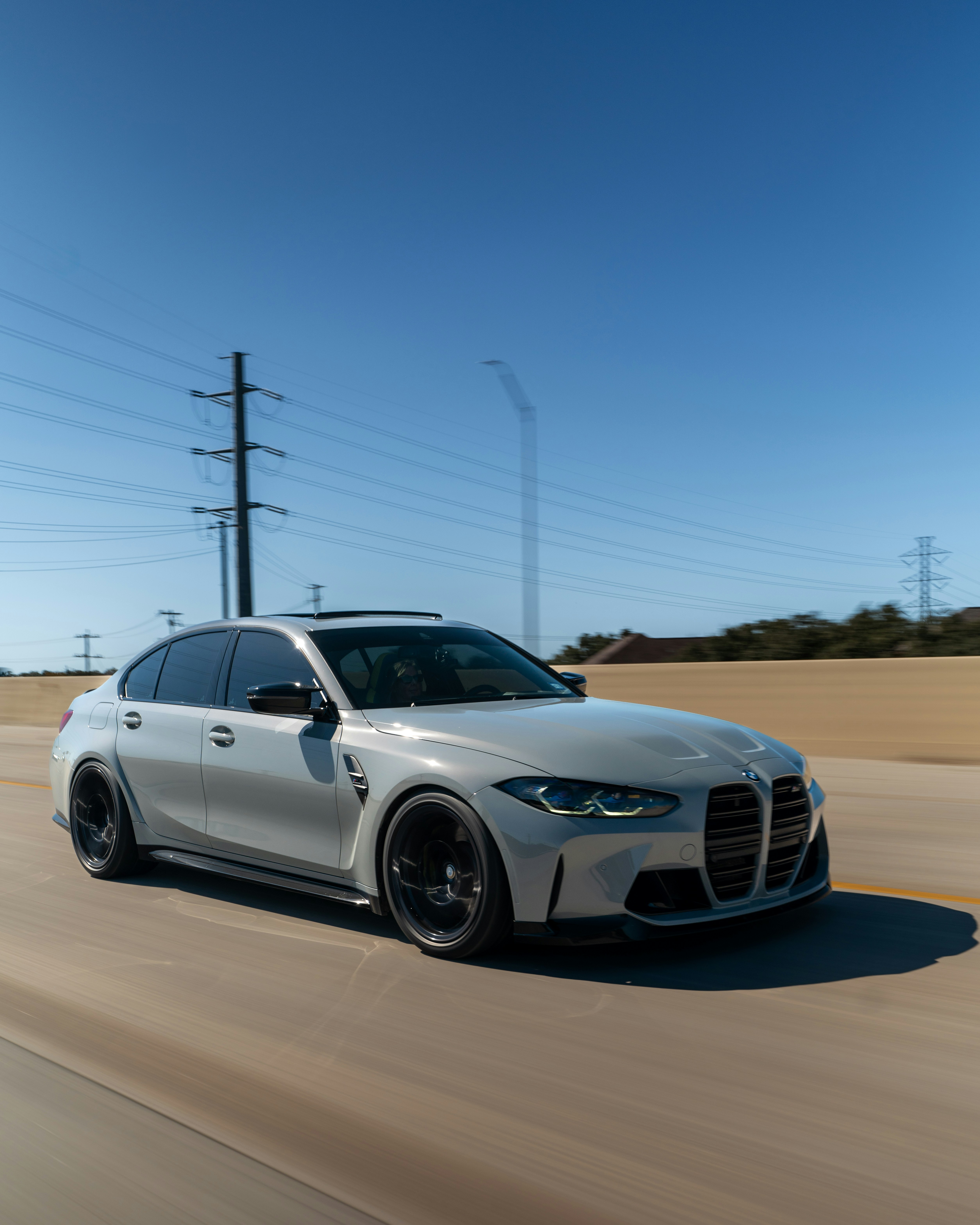 A silver BMW is speeding down the highway. photo – Free Car Image on ...