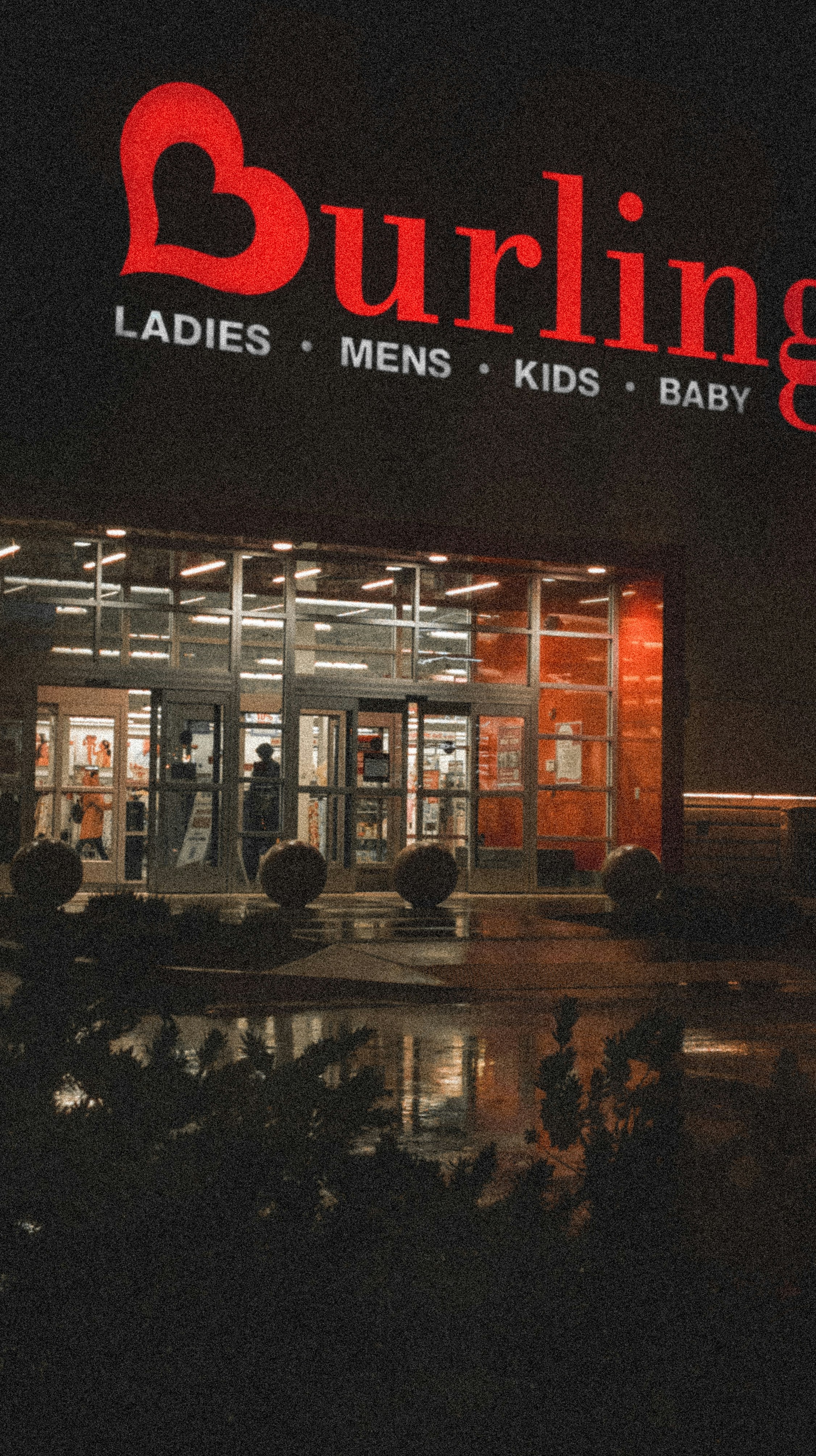 Heart Above the Threshold: Night Lights on a Glass-Faced Storefront
