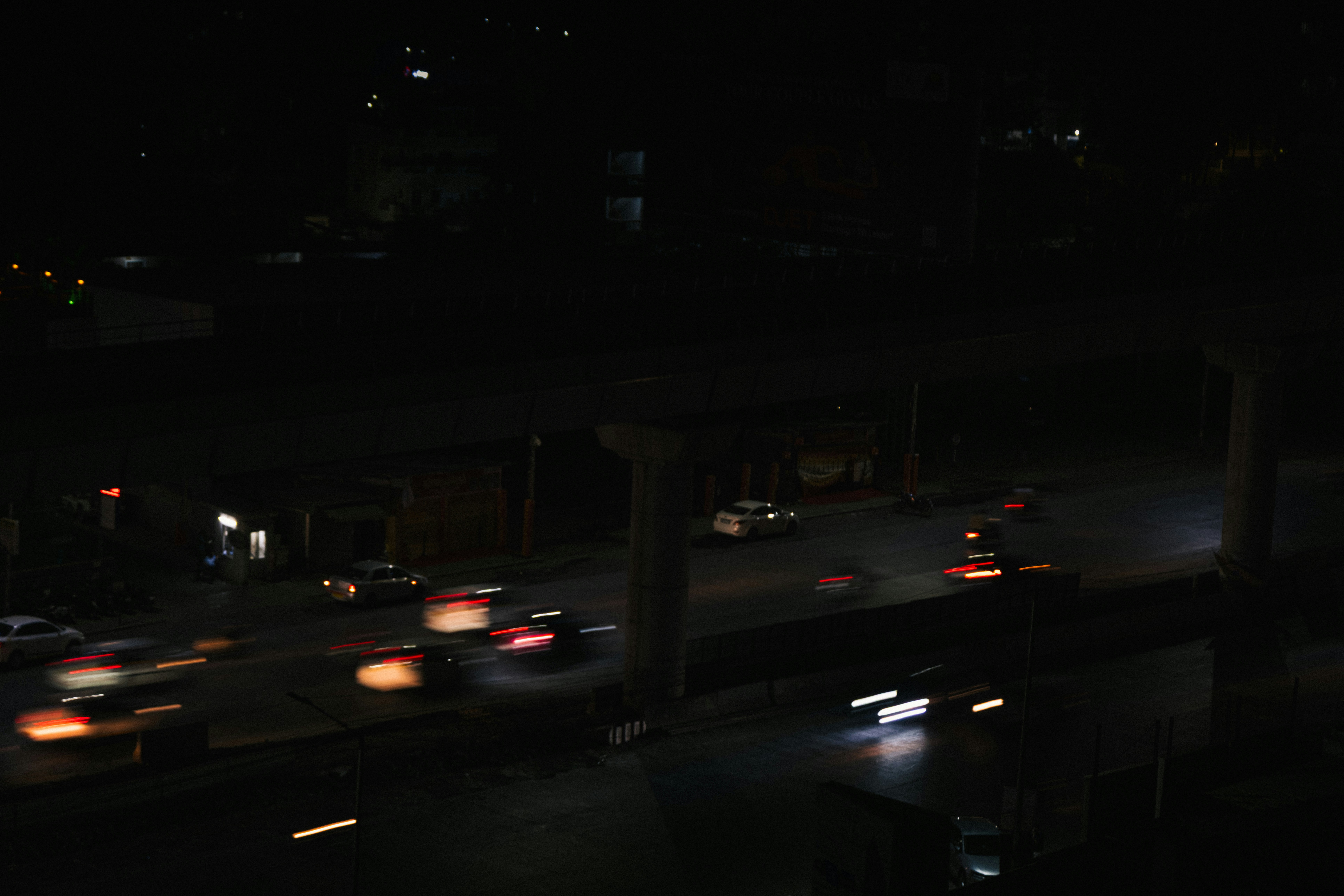 Nighttime traffic streams along a dimly lit road. photo – Free Car ...