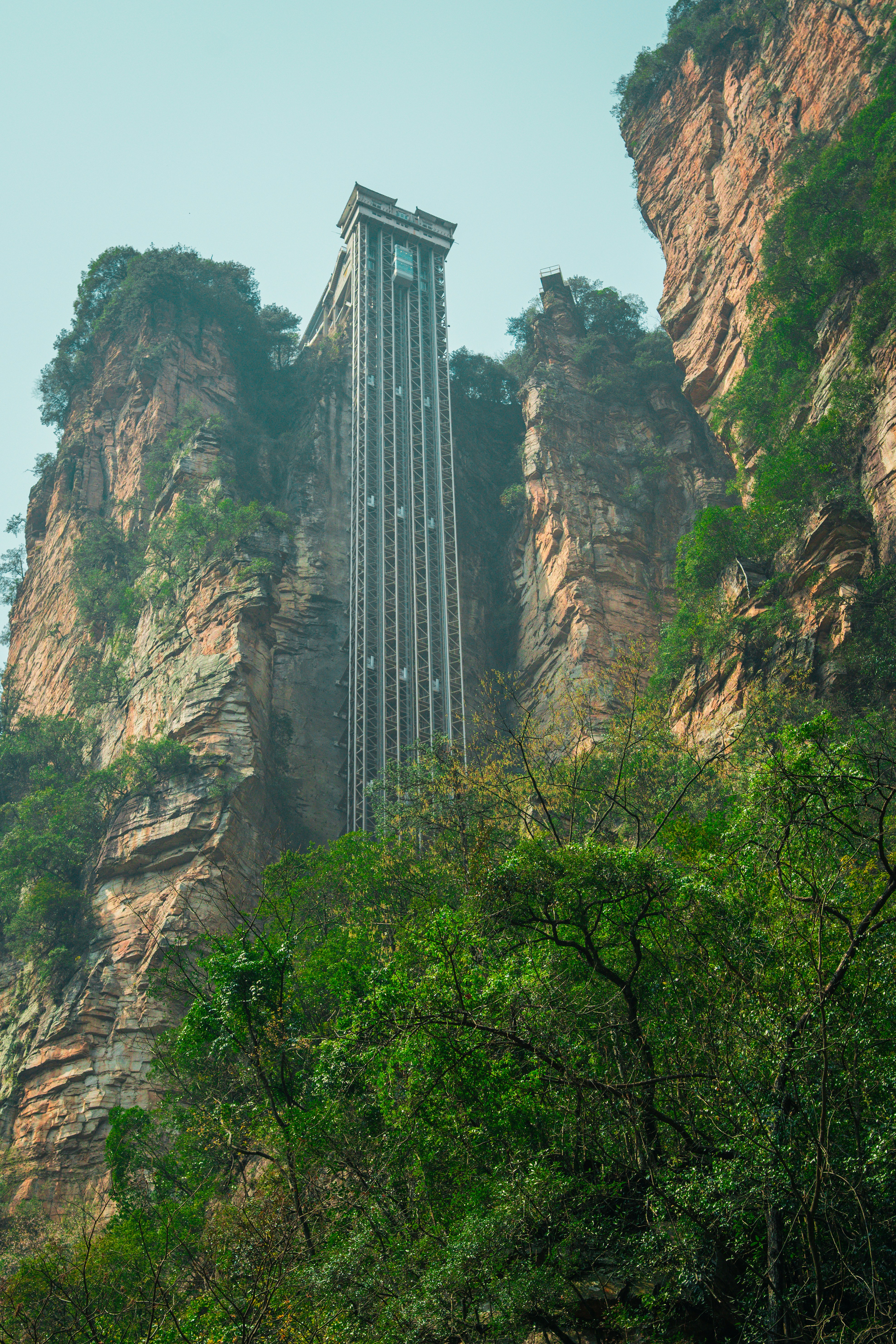 Tower Between Titans: An Elevator-Like Structure Rises Between Red Cliffs