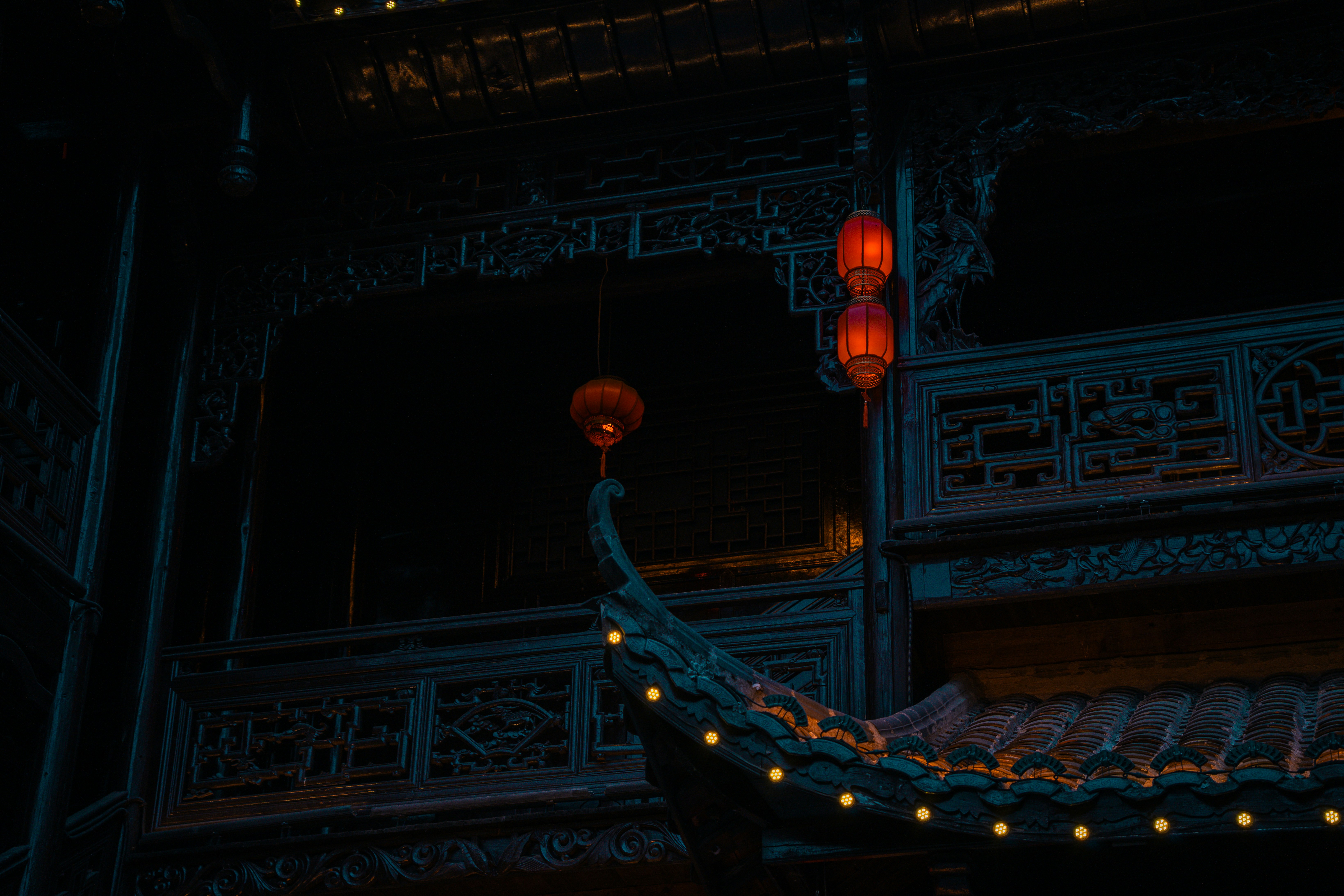 Blue Hour Lanterns Crown a Dragon-Eaved Pavilion