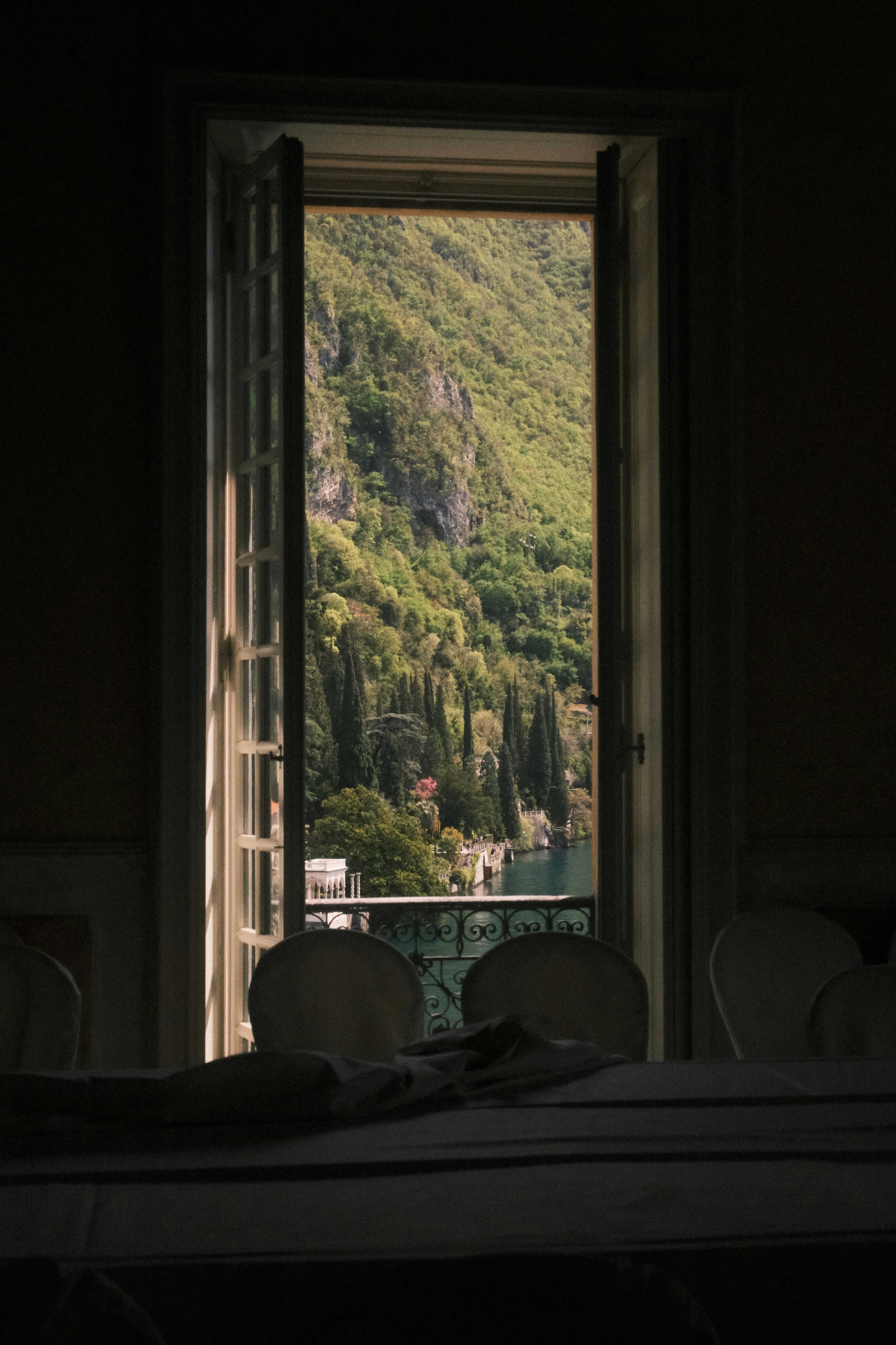 A scenic mountain view is framed by an open window. photo – Free Italy ...
