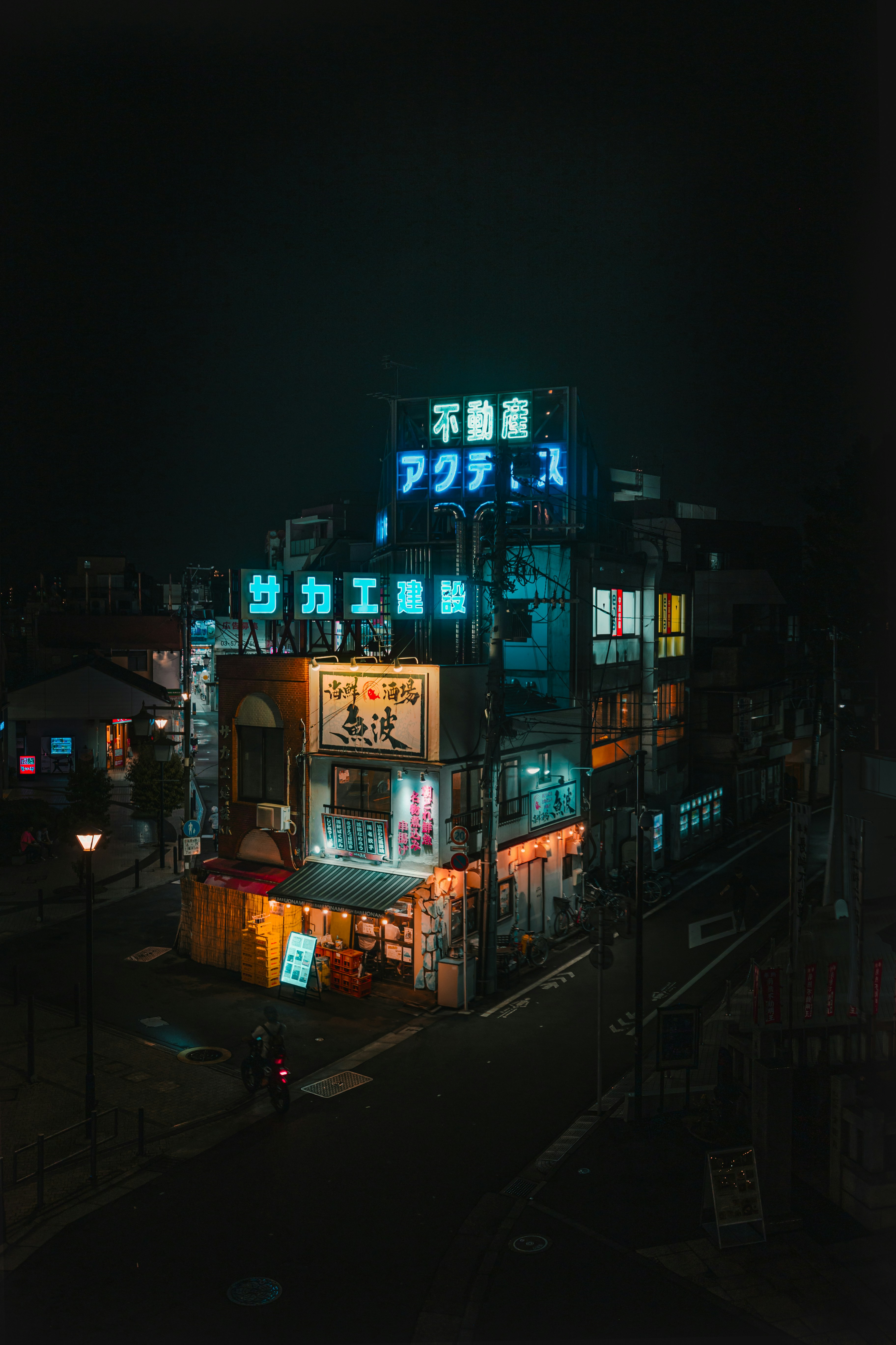 Neon signs light up a building at night. photo – Free Building Image on ...