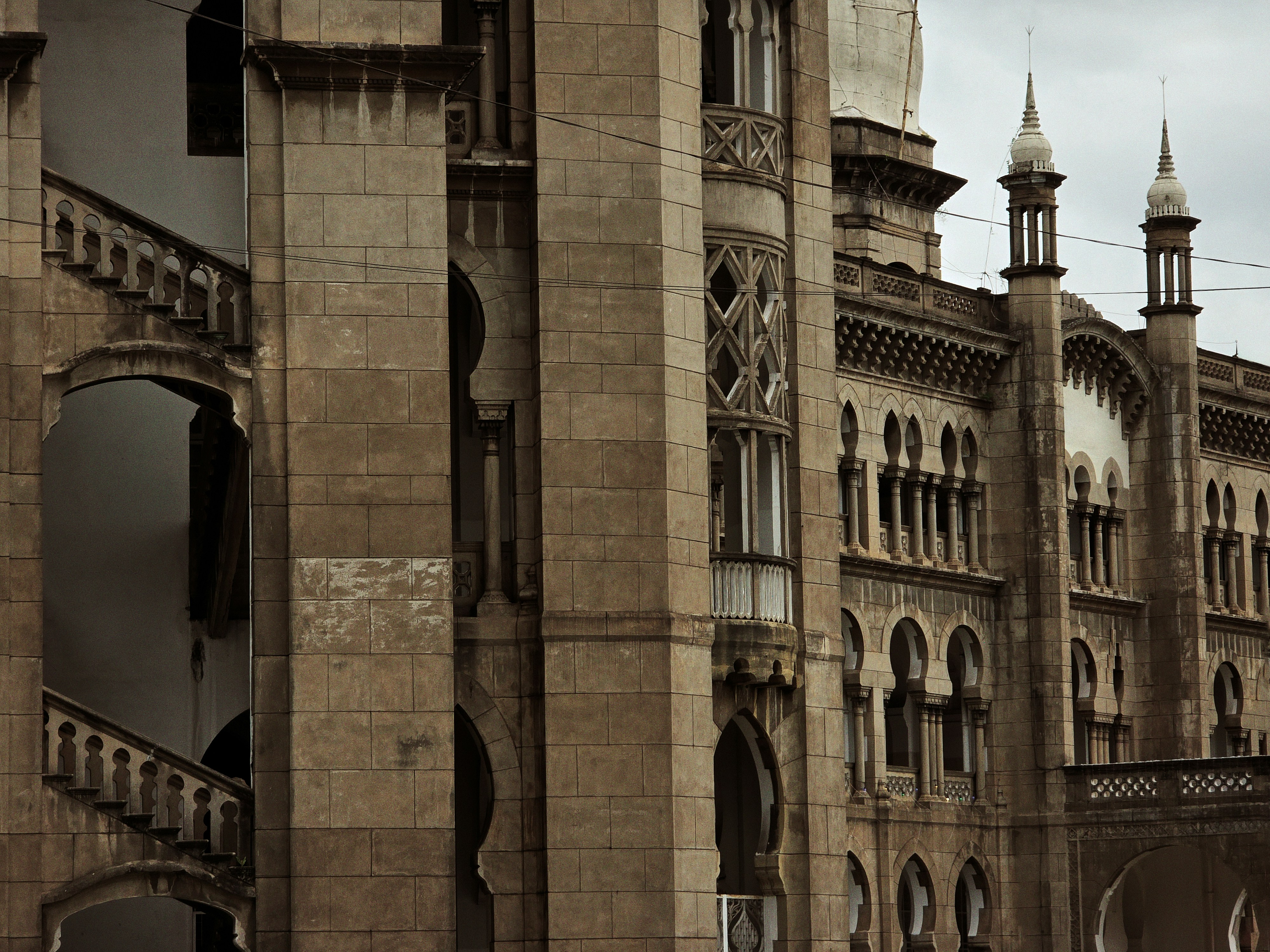 Old, elaborate architecture adorns the building's exterior. photo ...
