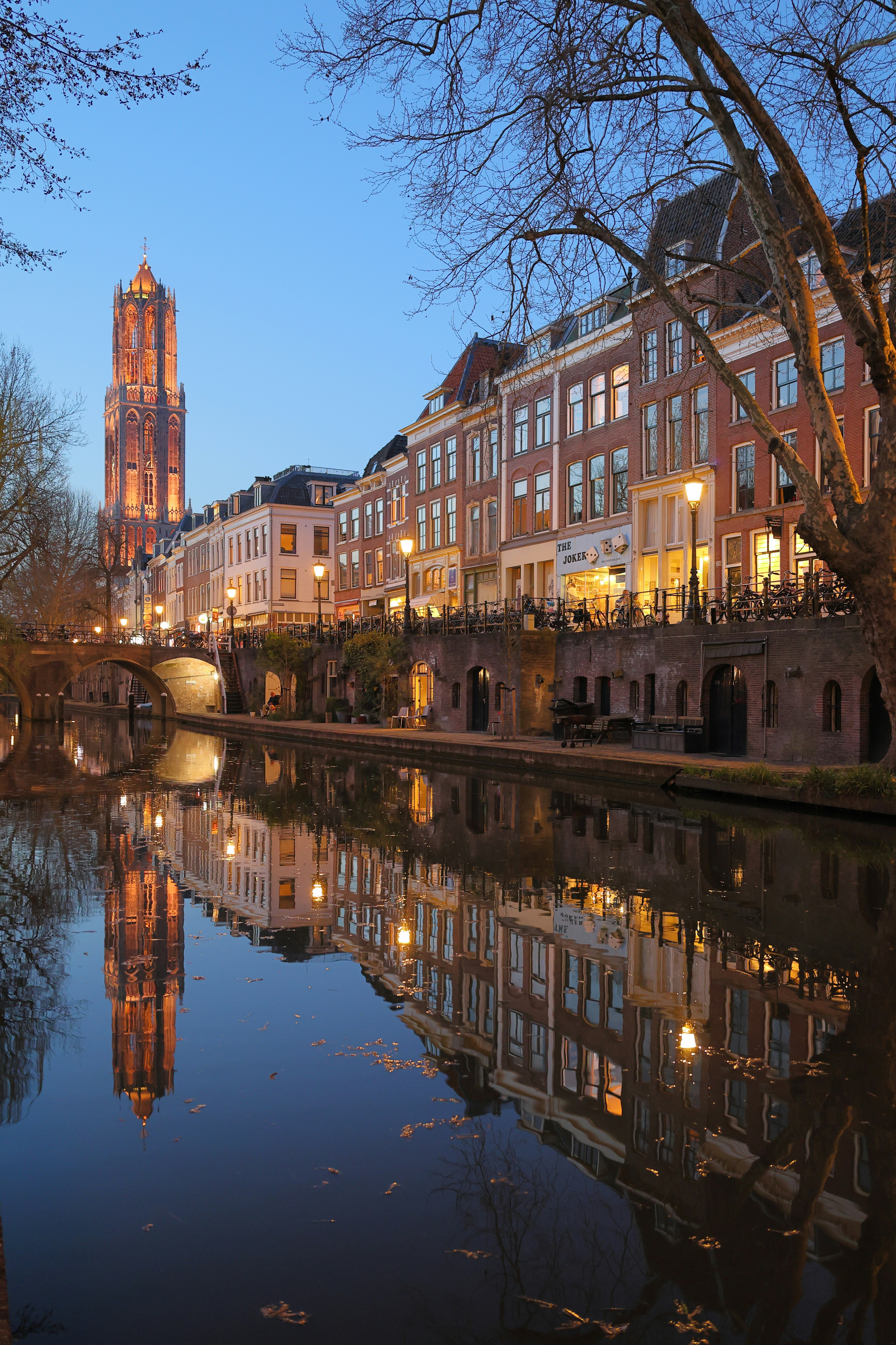 Twilight Over Utrecht: Dom Tower Framing a Quiet Canal of Brick and Reflection.