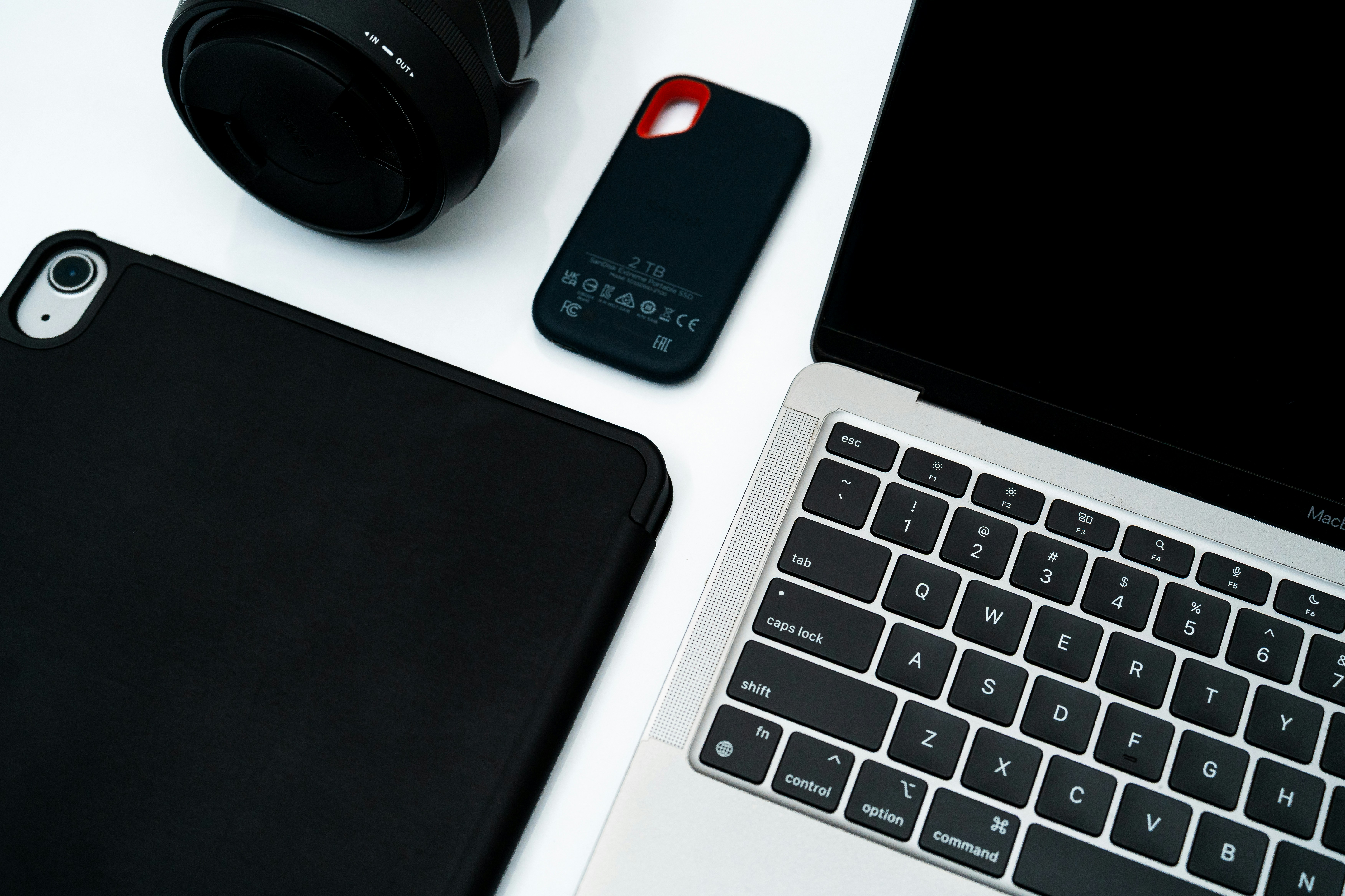 Electronic devices arranged on a white surface. photo – Free Business ...