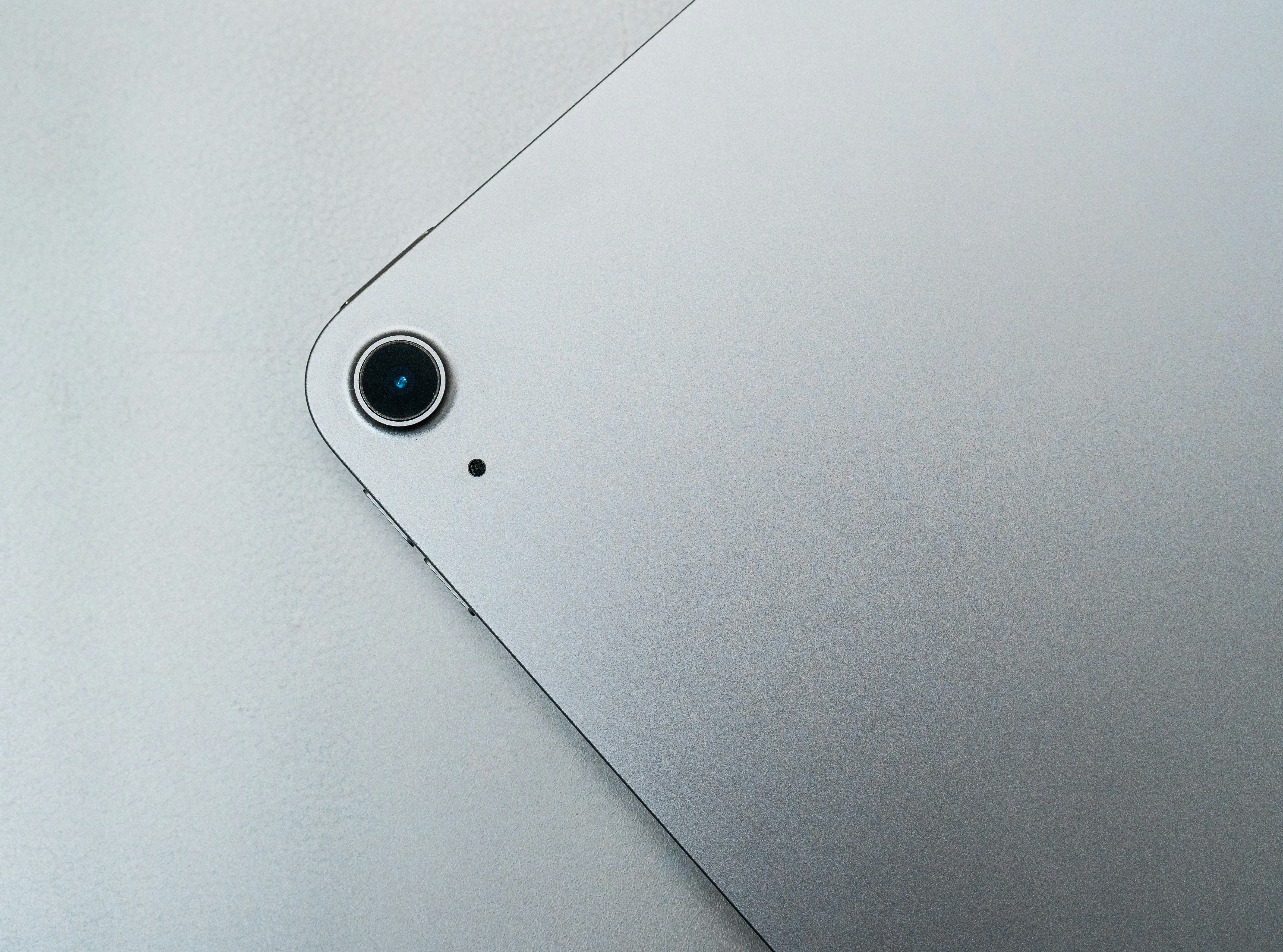 Back corner of a silver tablet is shown. photo – Free Business Image on ...