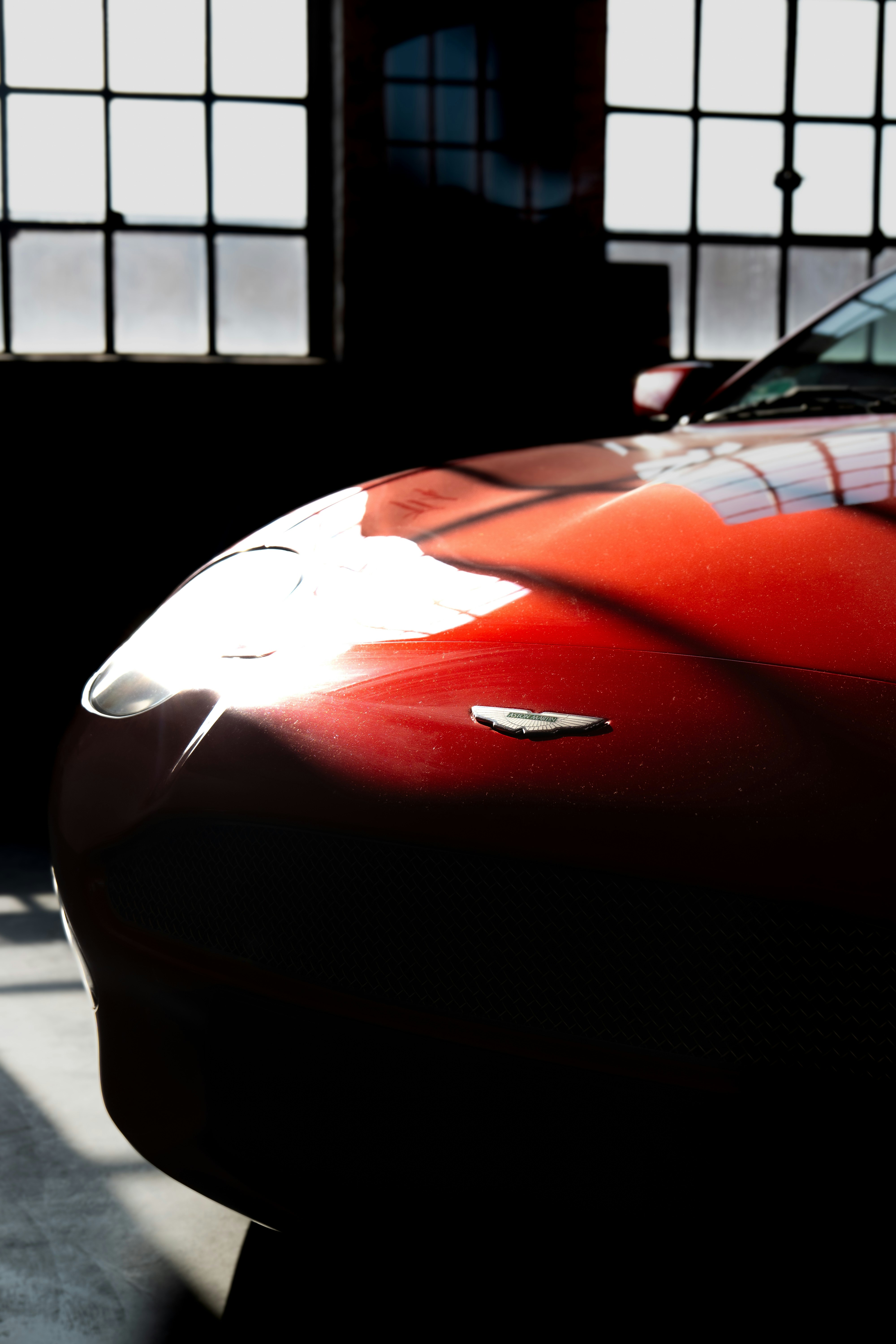Reflections in Motion: The Aston Martin's Dance with Light