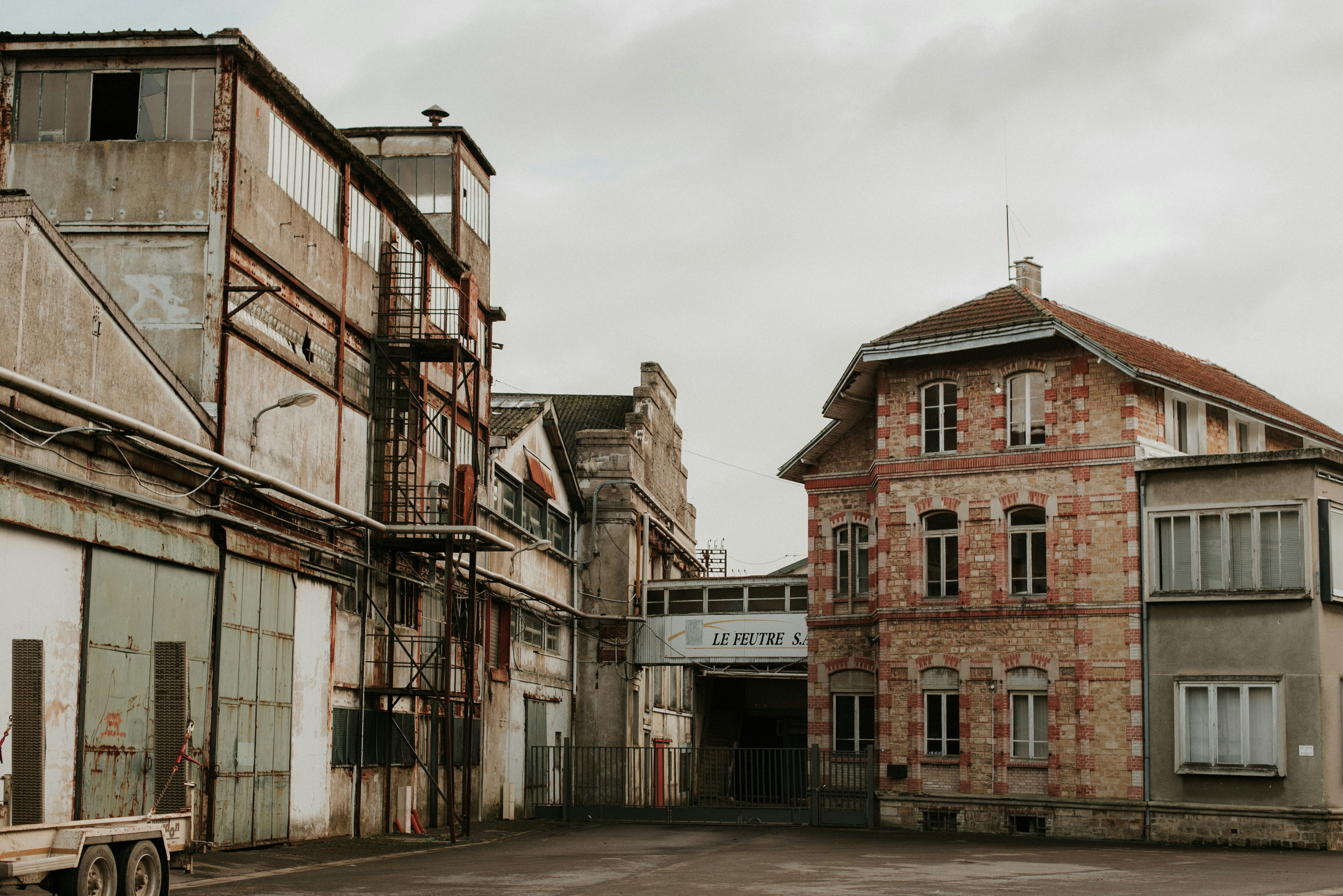 Old and weathered buildings stand under a cloudy sky. photo – Free ...