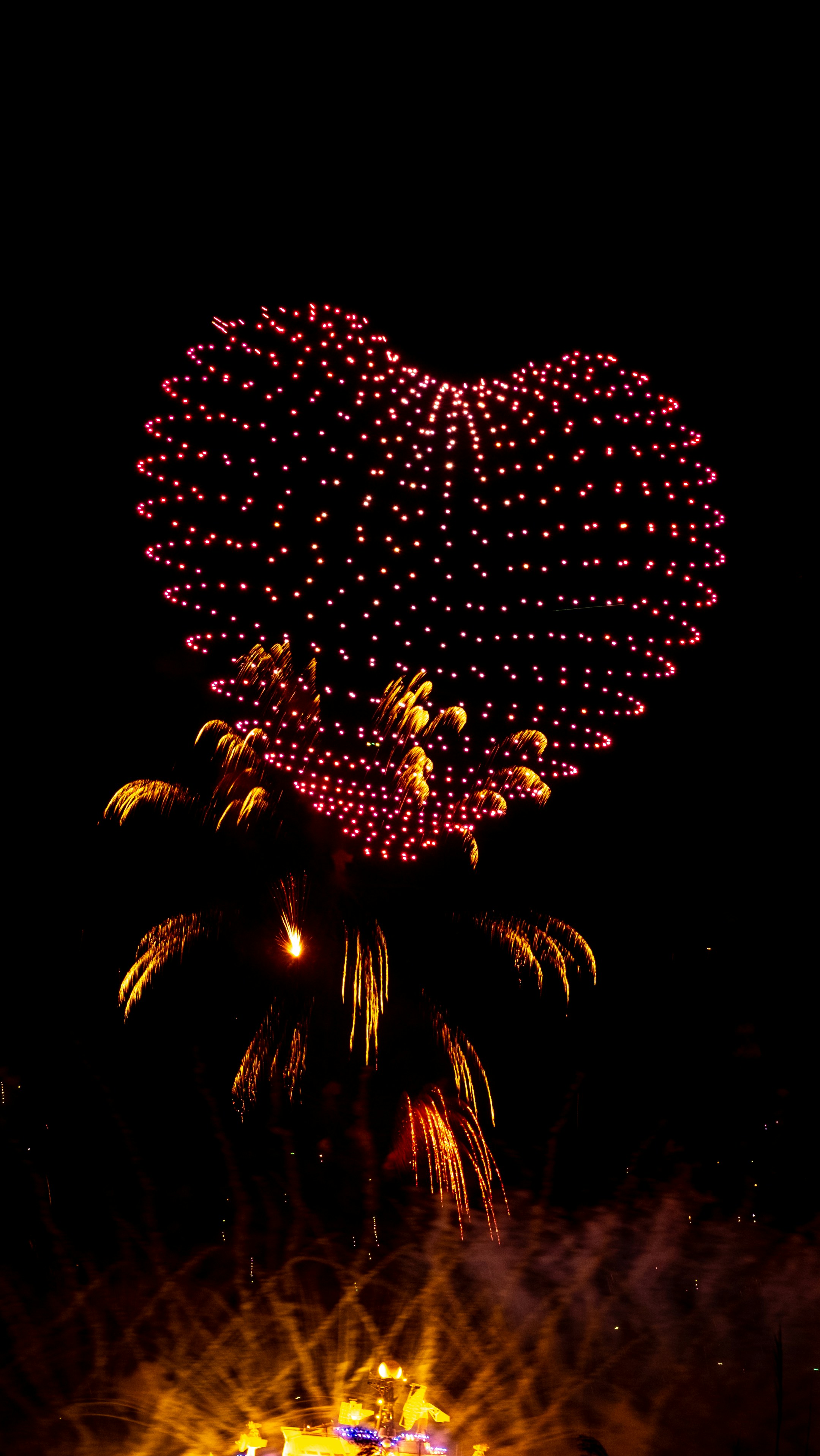 Neon Heartrise: Firework Bloom Over a Palm-Silhouetted Night