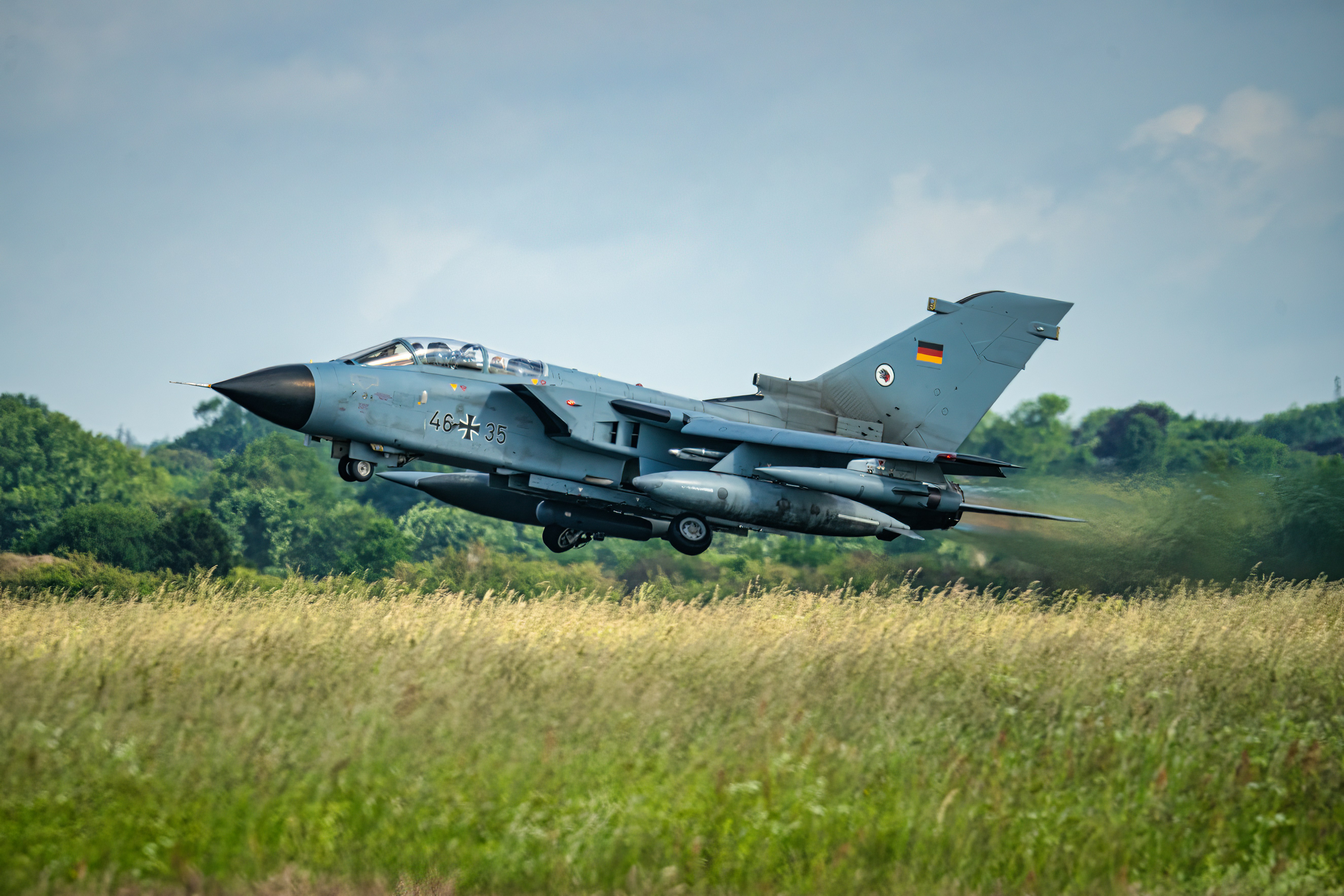 German tornado jet taking off from grassy field. photo – Free Nato ...