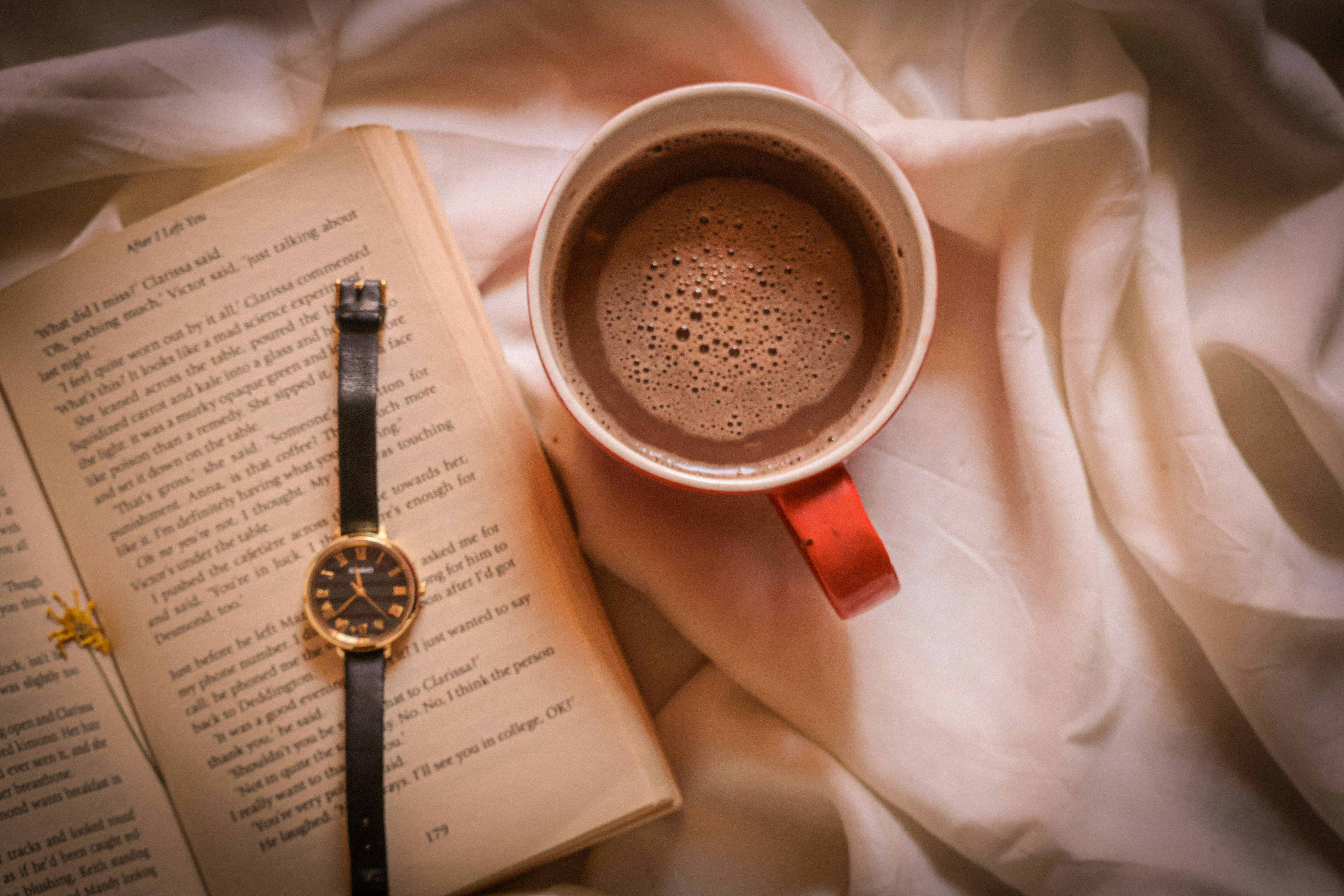 Morning Ritual in Amber Light: Coffee, Clock, and a Page