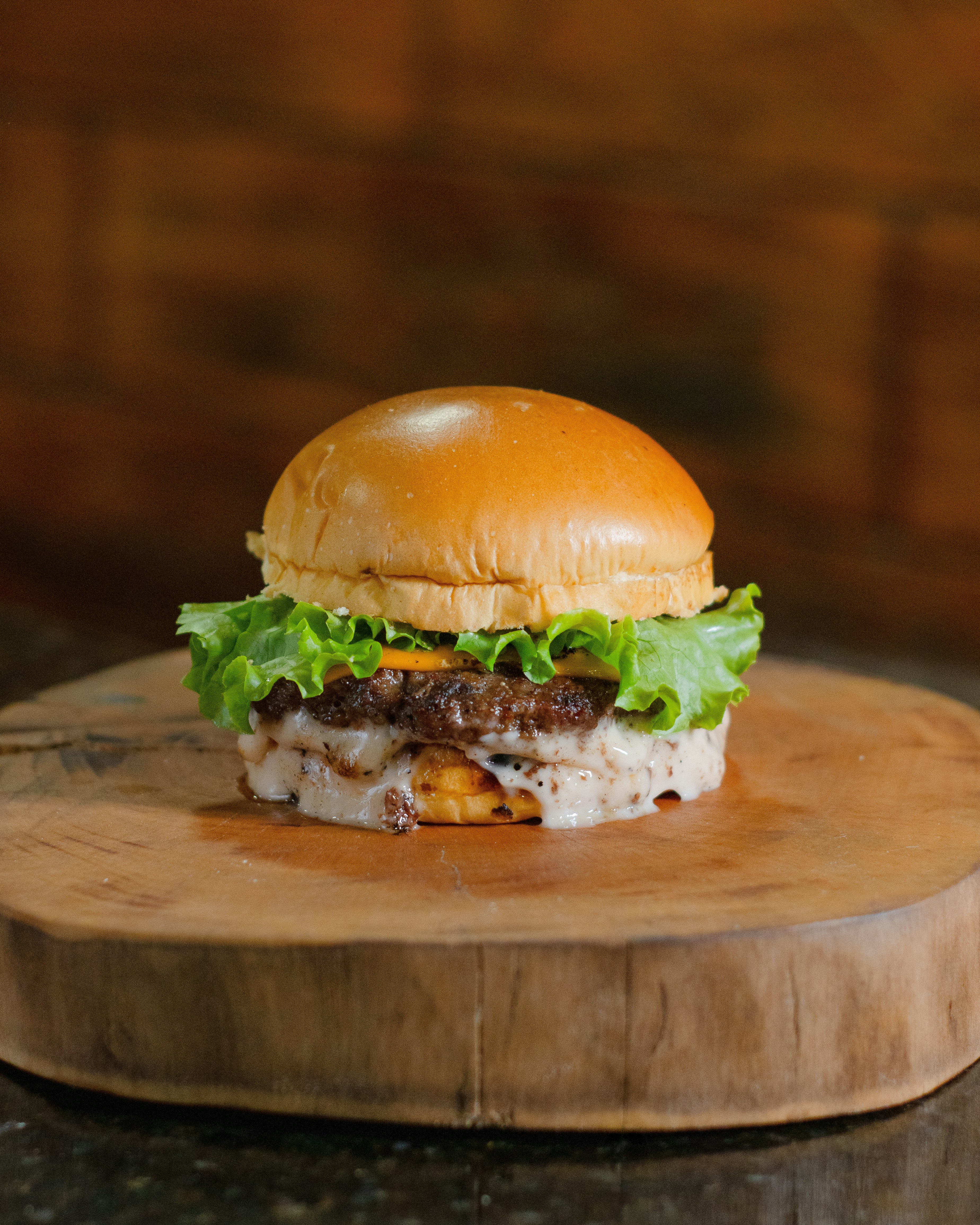Smash Burger on a Wooden Stage: Melted Cheese, Crisp Lettuce, and a Golden Bun