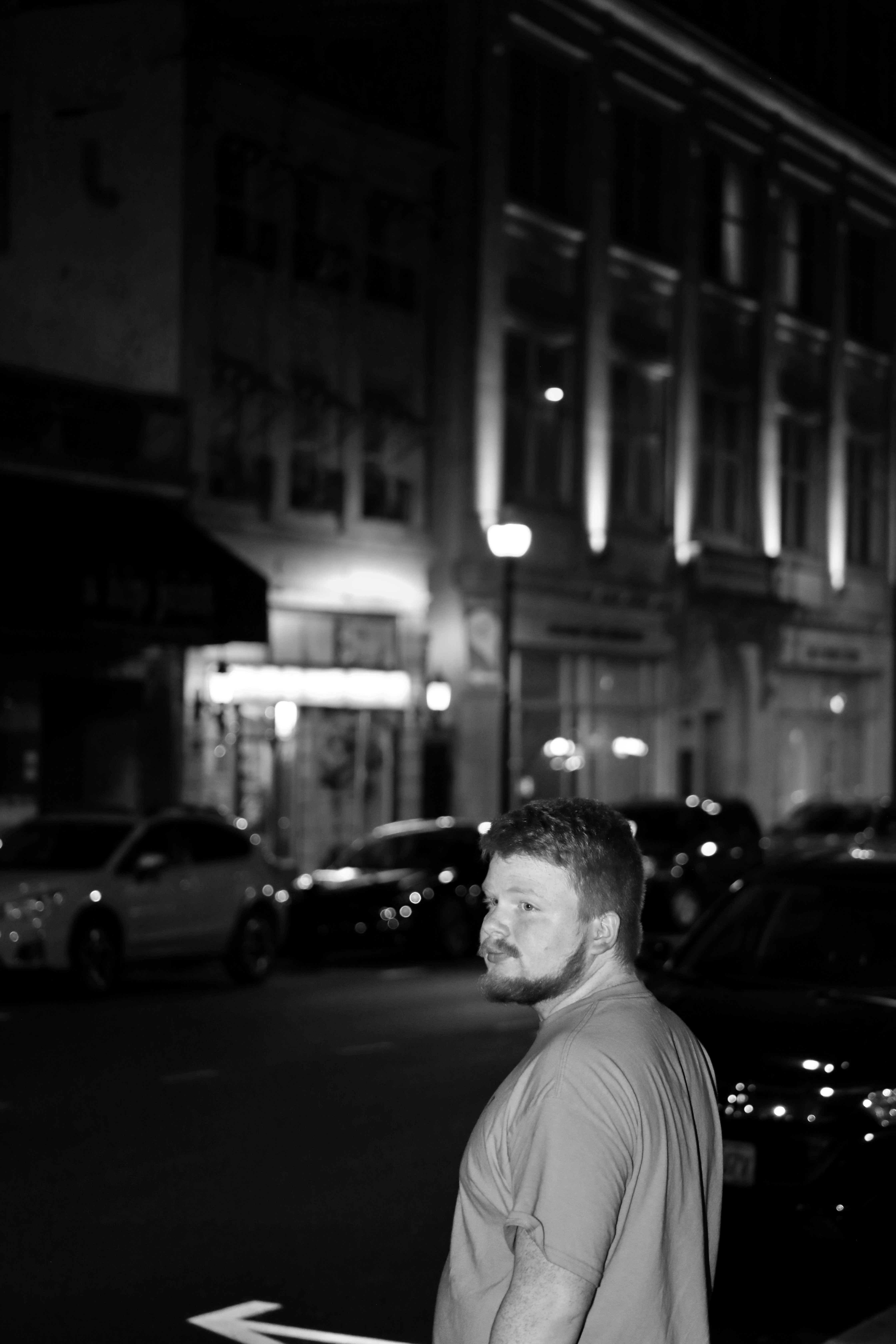 Night Street Portrait: A Quiet Moment Under Neon Glass