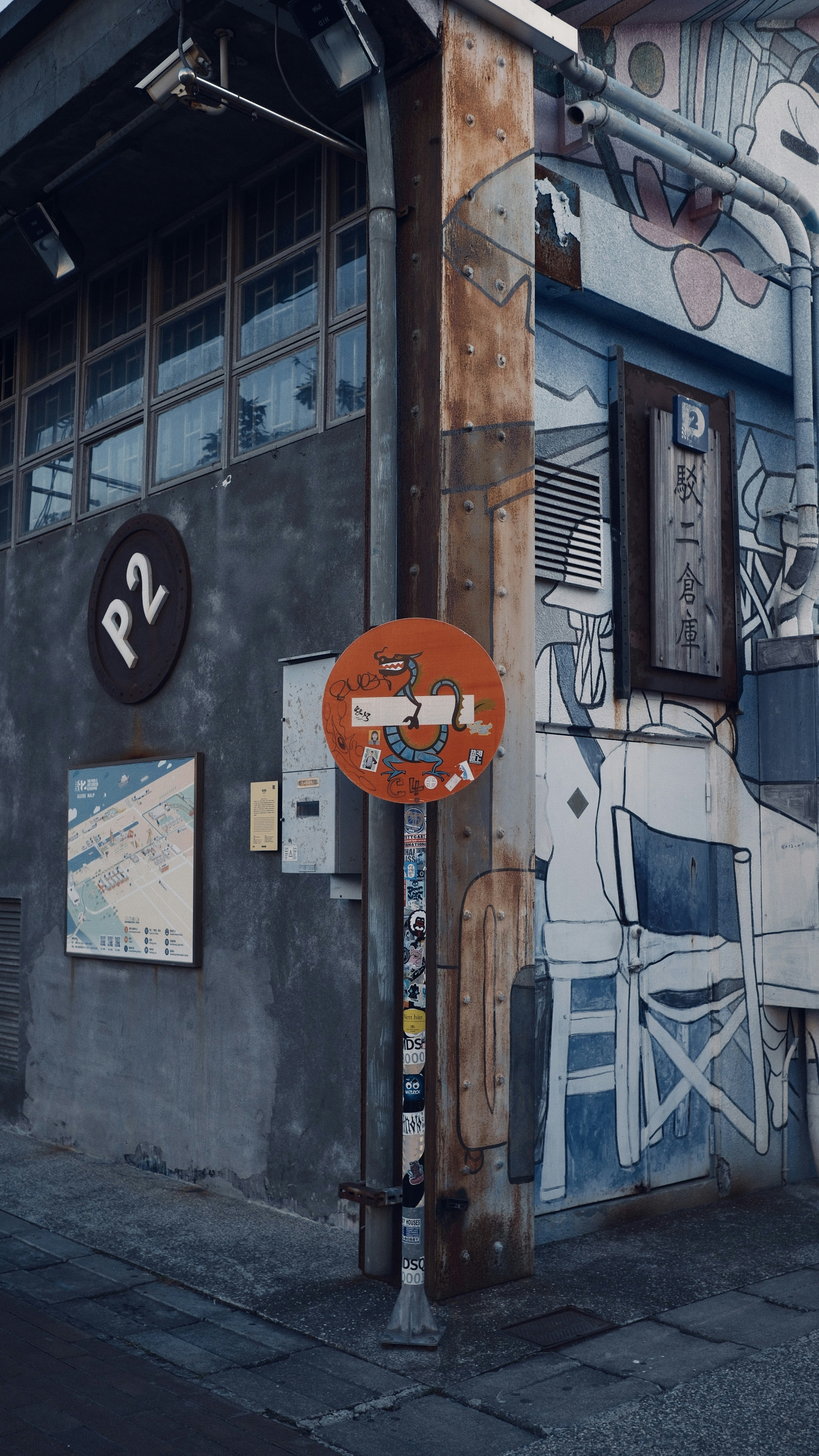 Anchor in an Urban Graffiti Corner: The Orange Circular Sign